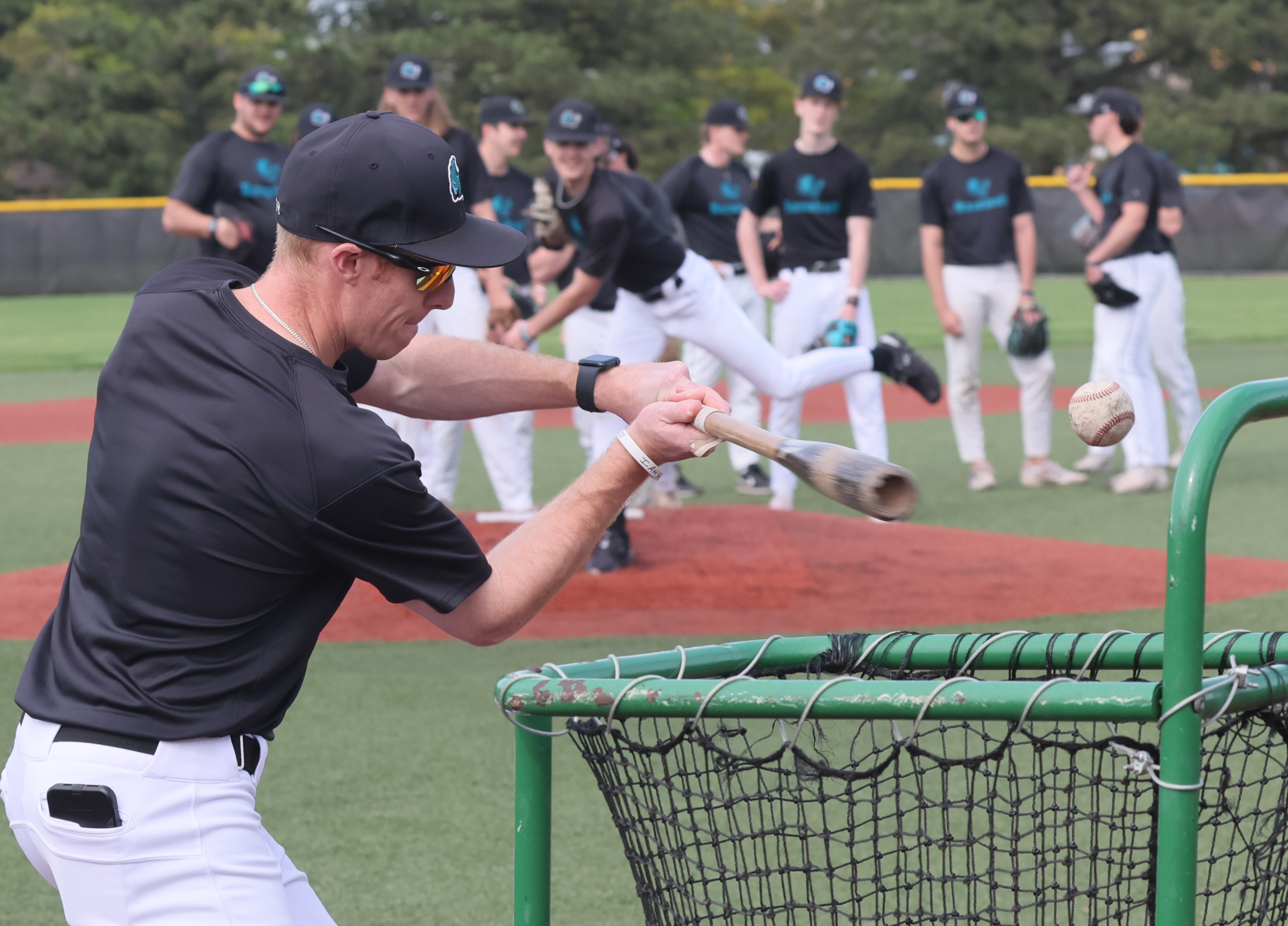 The Tri-C Triceratops baseball team practices before the start of their ...
