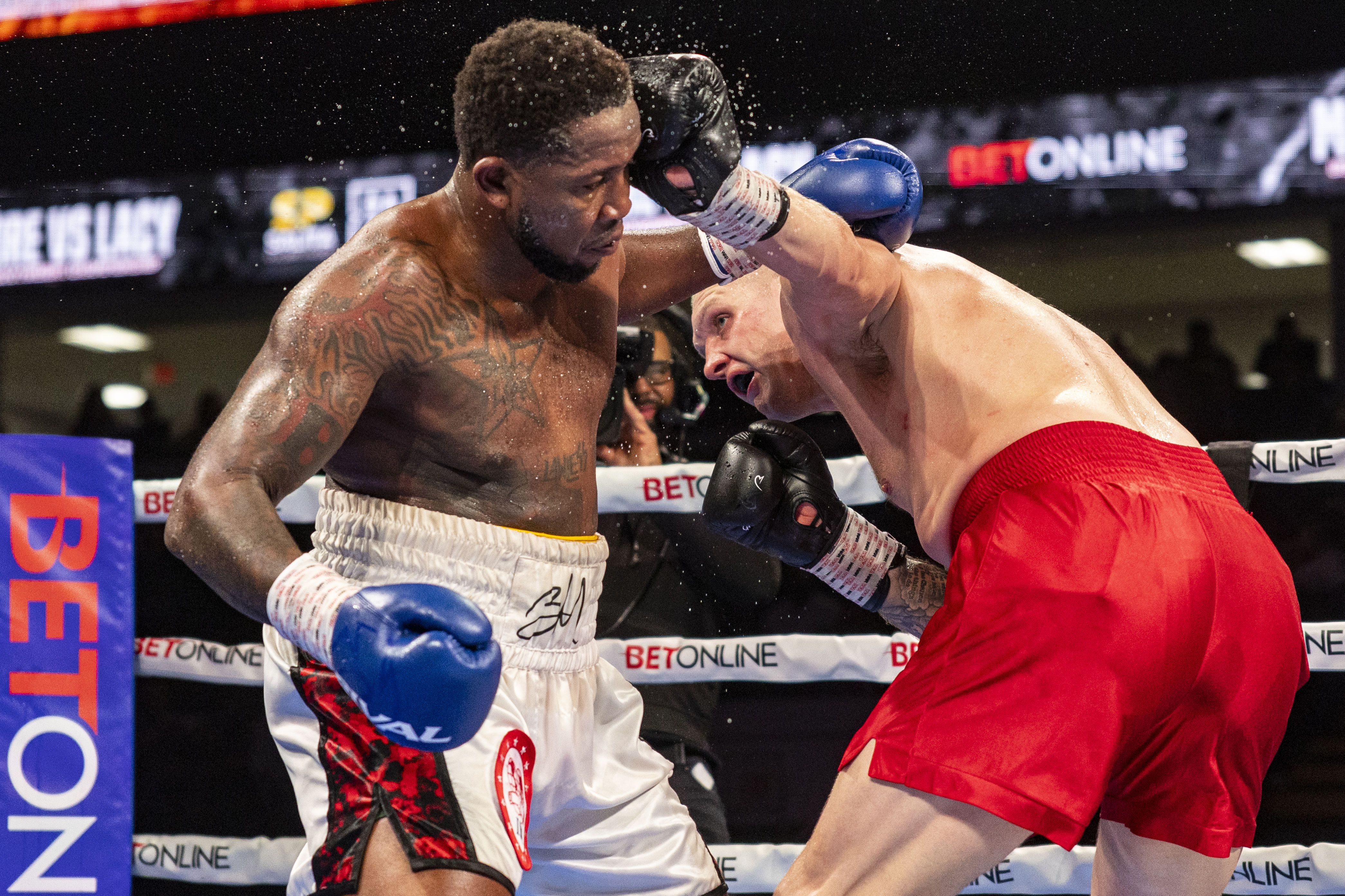 Boxers fly out of the ring and into crowd in WWE style at Michigan bout ...