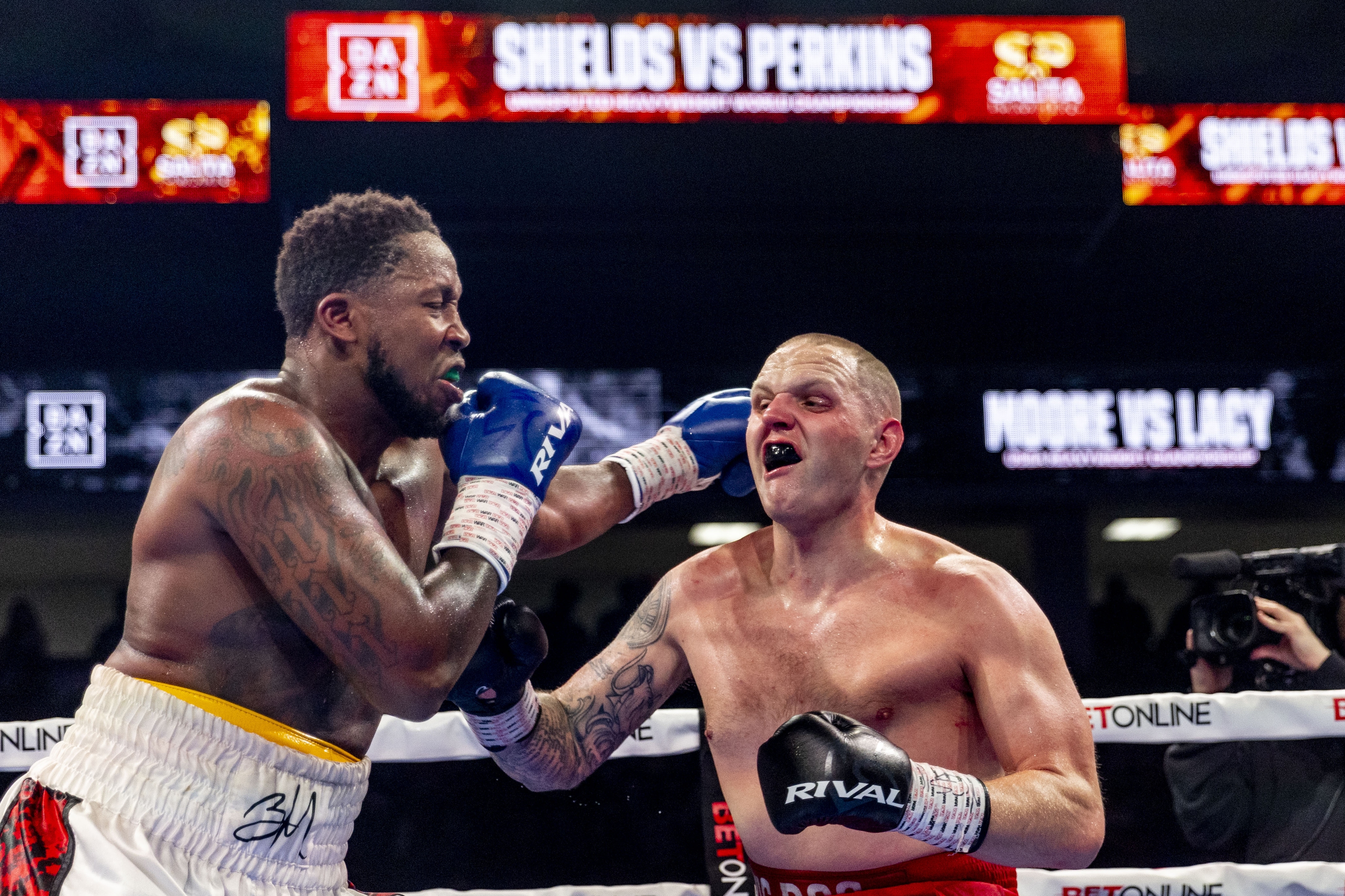 Boxers fly out of the ring and into crowd in WWE style at Michigan bout ...