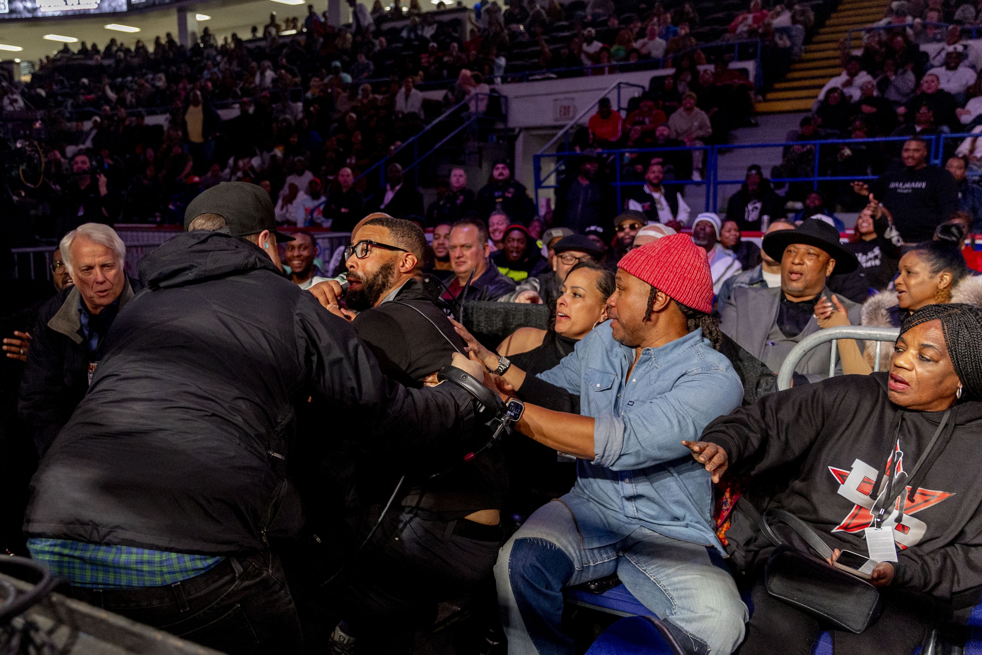 Boxers fly out of the ring and into crowd in WWE style at Michigan bout ...