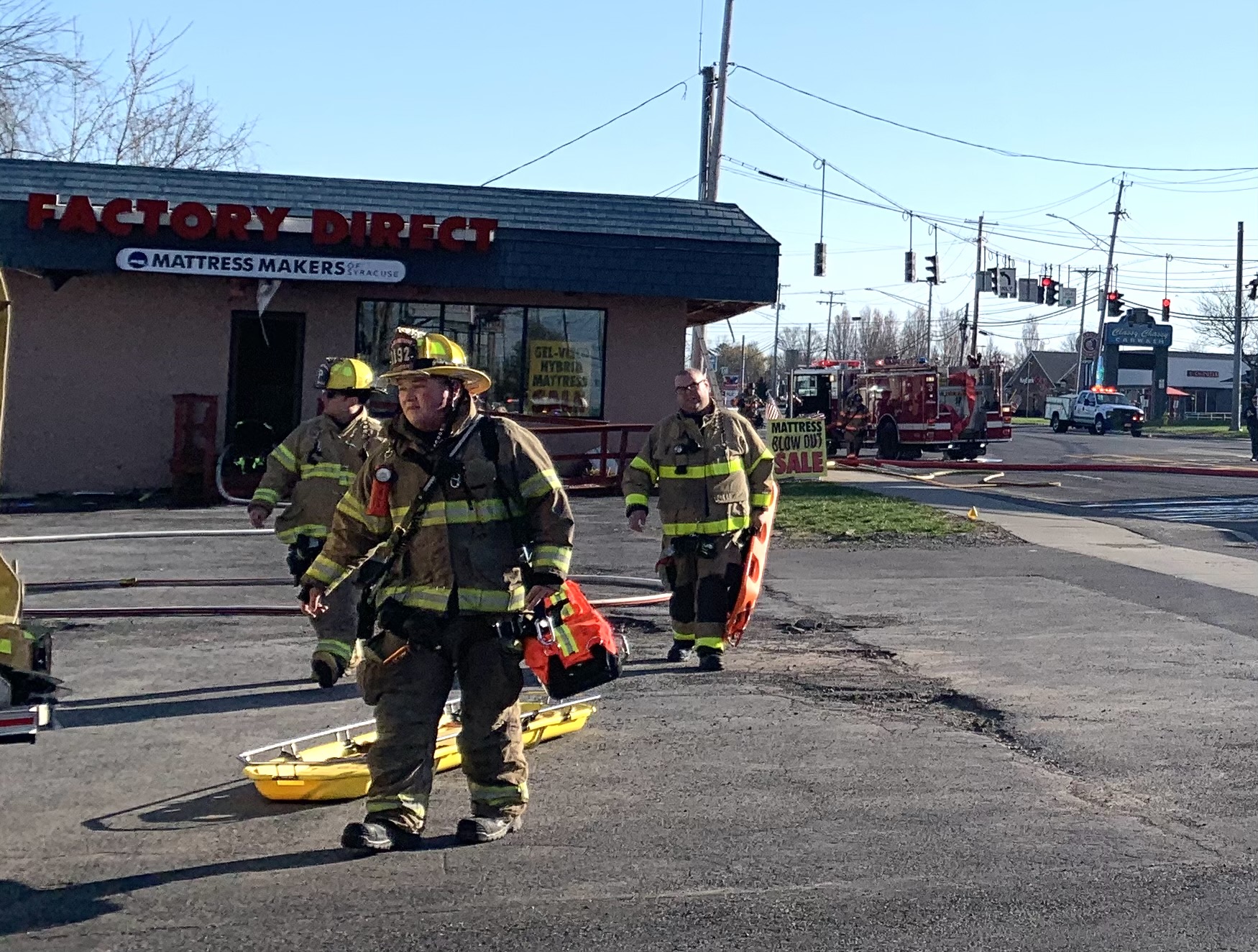 Fire damages mattress store in Cicero; commuters drive over hoses