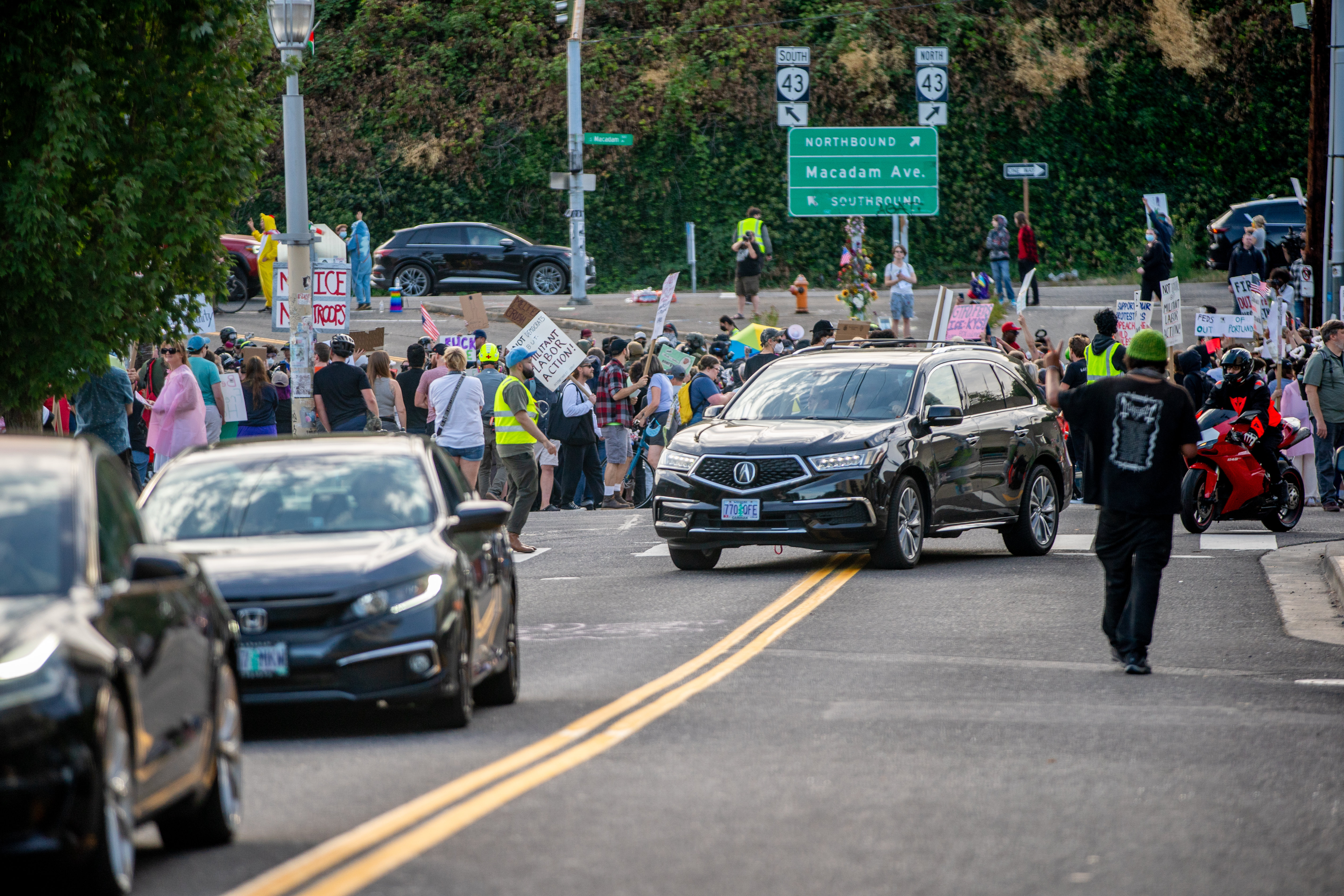 Portlanders take to the streets as Trump administration mobilizes ...