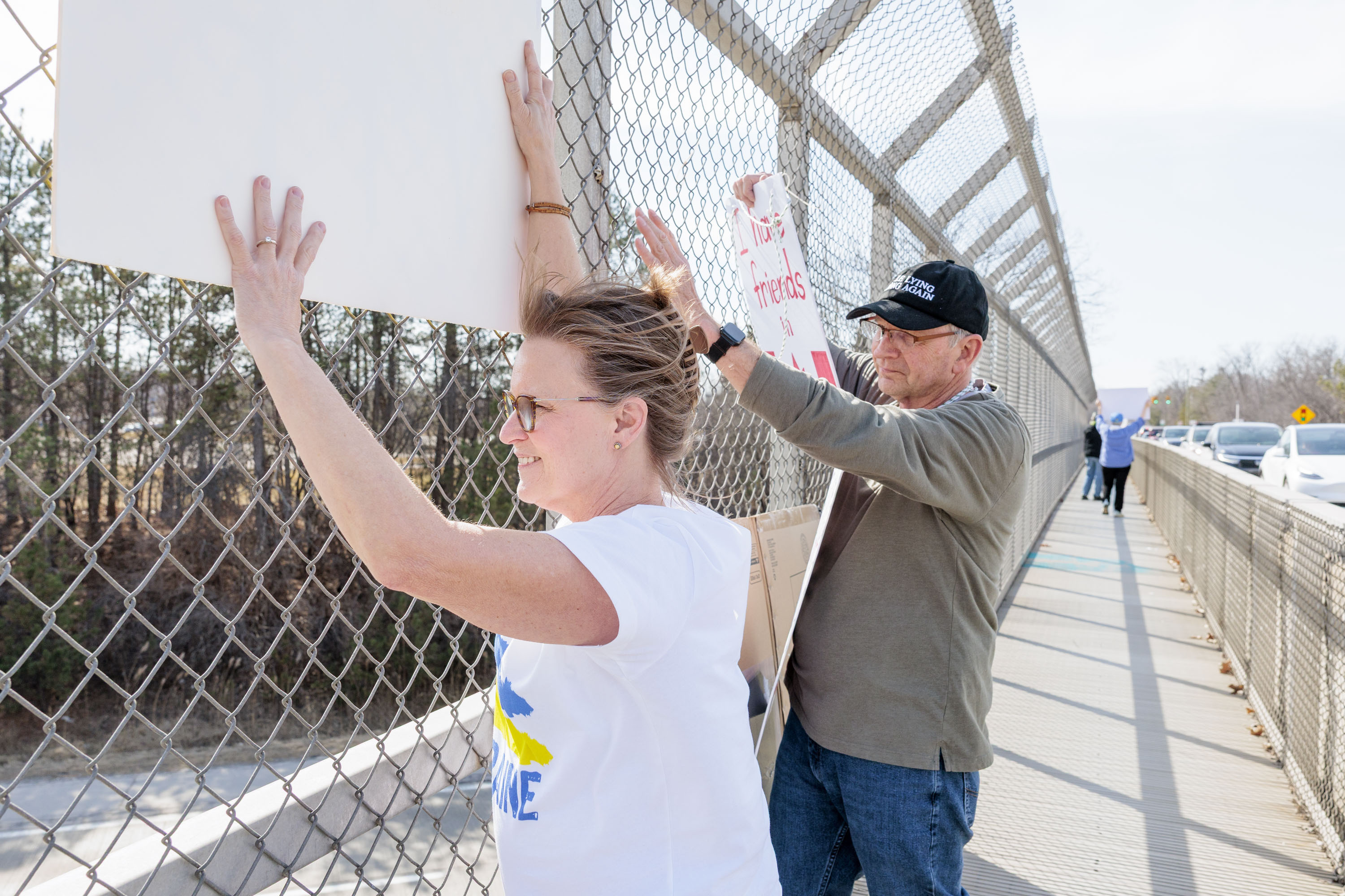 Demonstrators protest Trump Administration on four Ann Arbor pedestrian ...