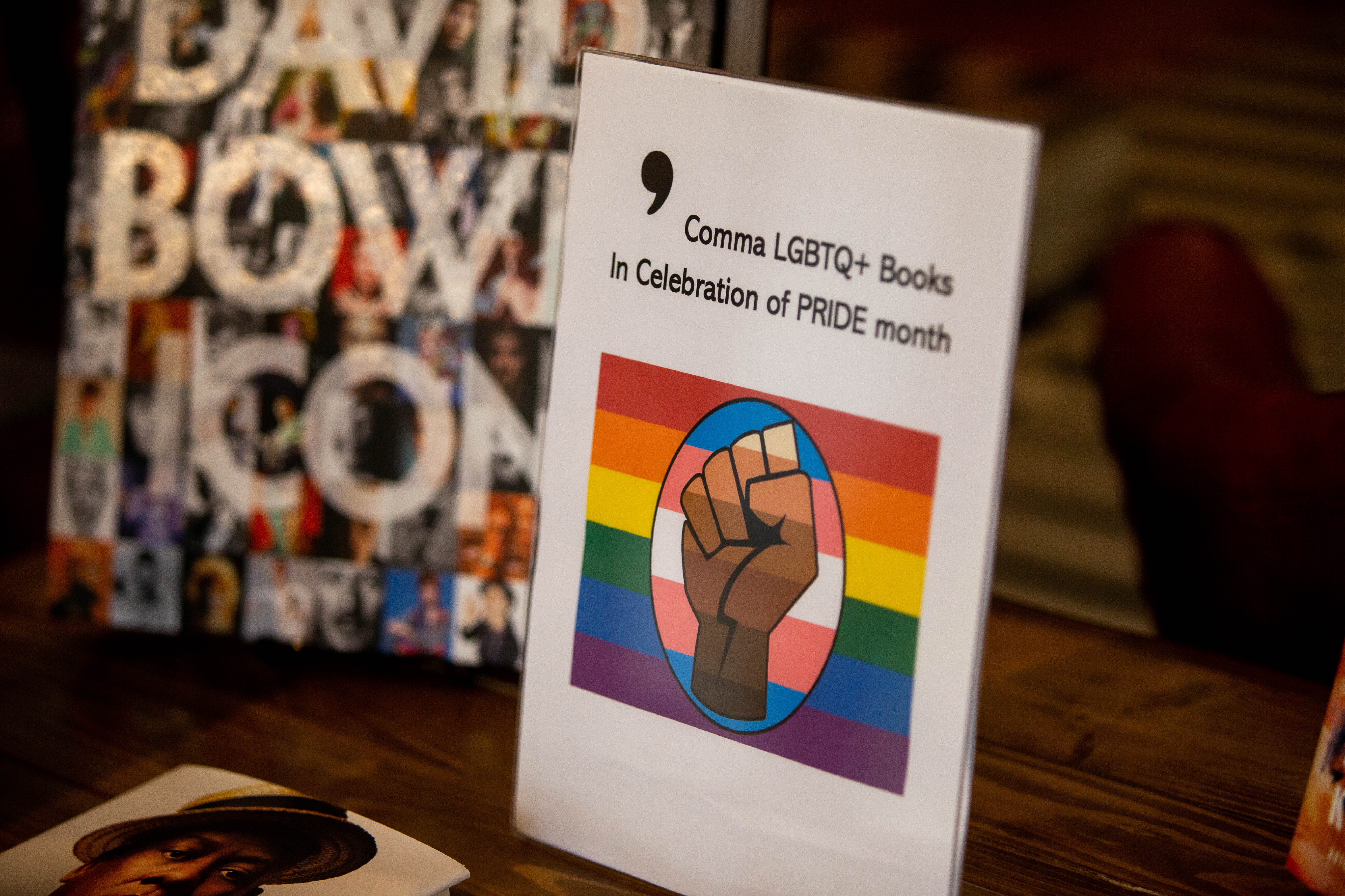 People share poetry and stories during Pride Month open mic poetry ...