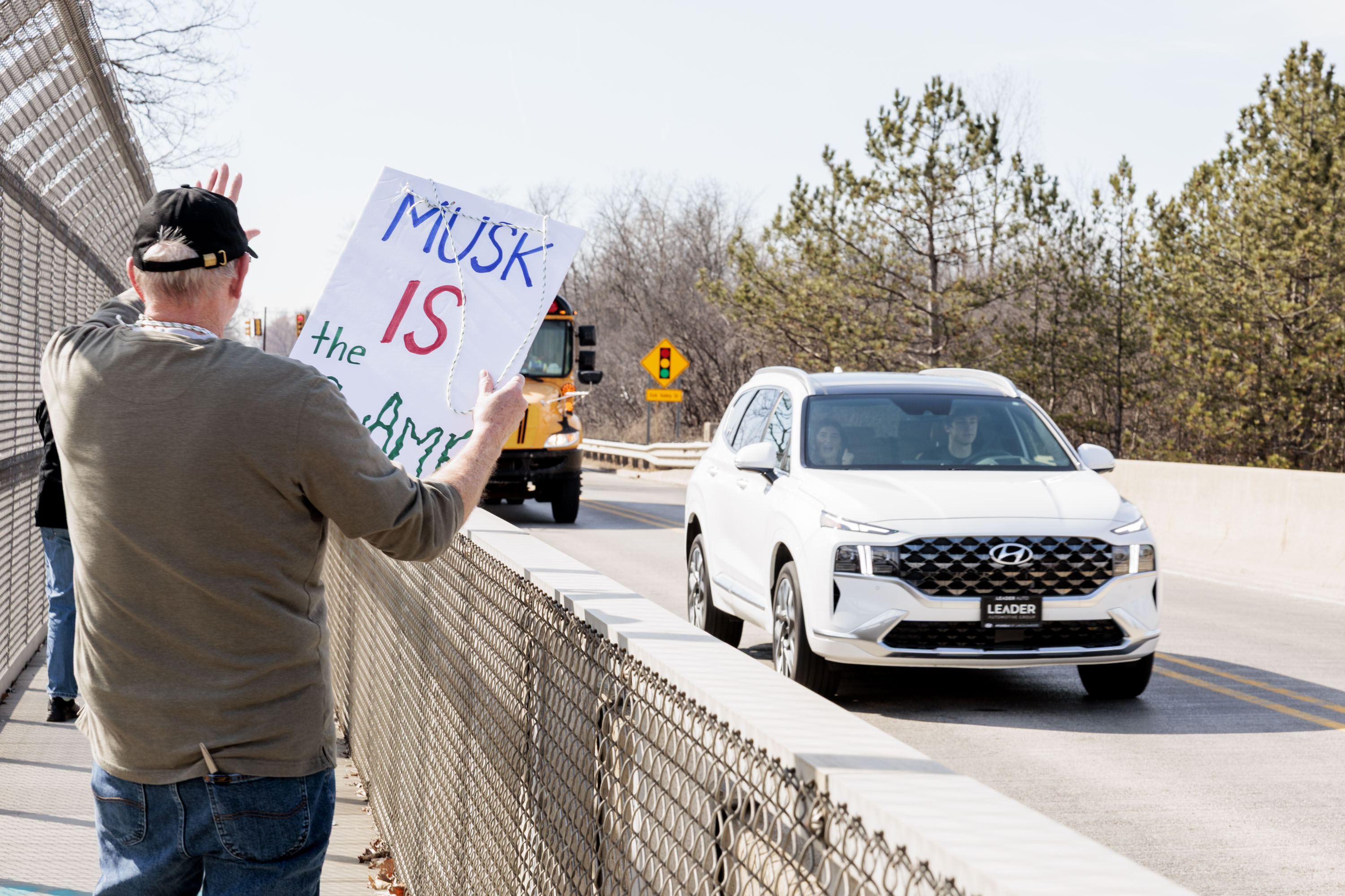 Demonstrators protest Trump Administration on four Ann Arbor pedestrian ...