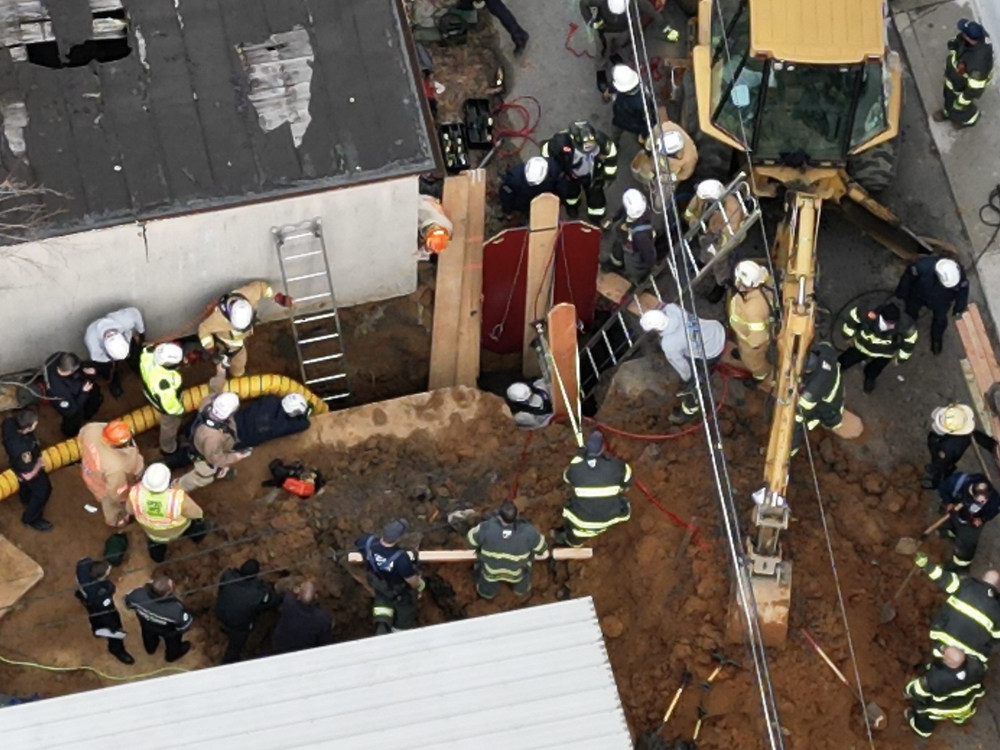 Worker rescued from trench collapse after 8 hours as temperatures ...