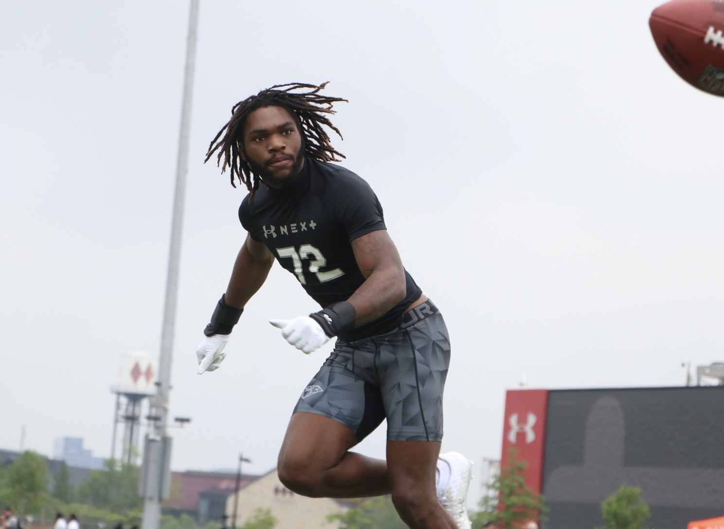 Imhotep Charter defensive end Zahir Mathis runs through drills during ...