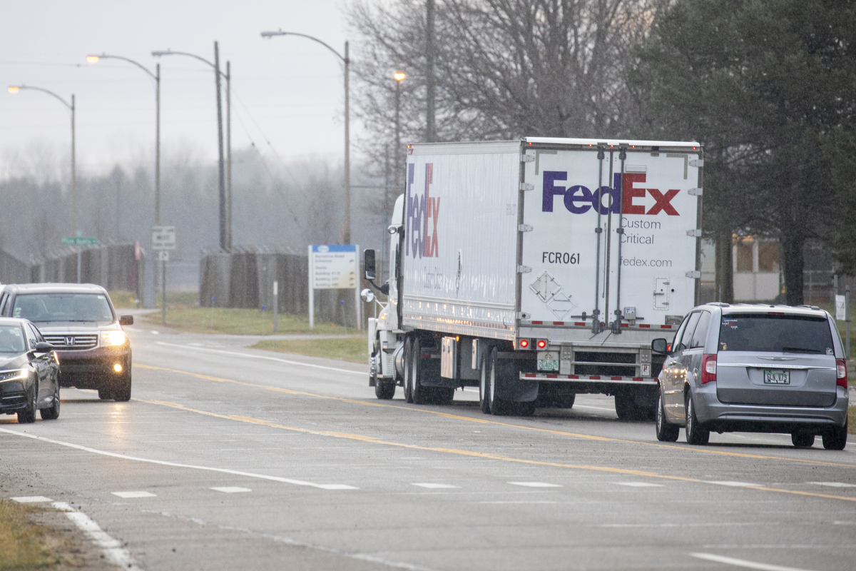 Trucks carrying COVID-19 vaccine depart Pfizer plant in Portage ...