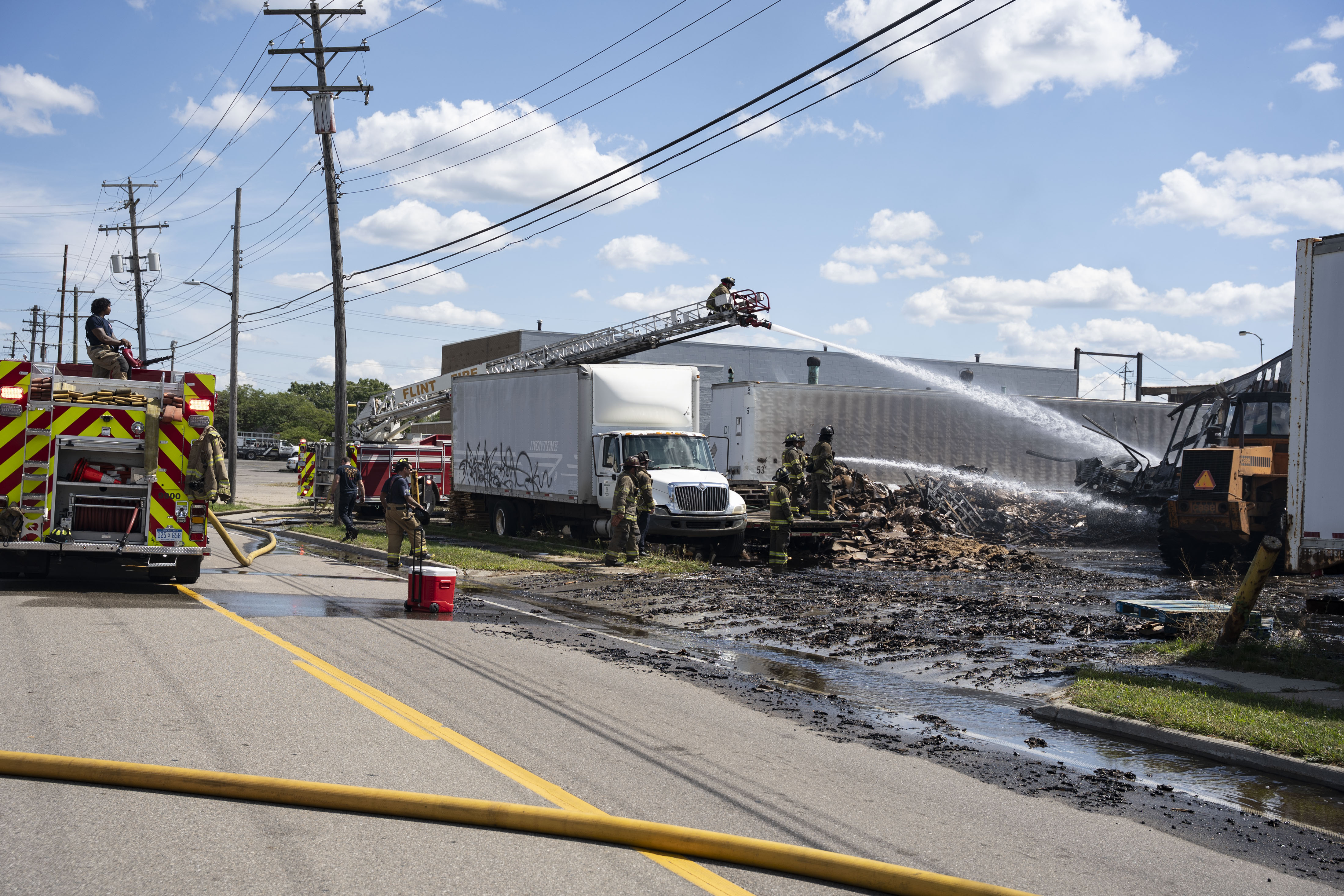 Firefighters work to extinguish a fire at D.I. Enterprises - mlive.com