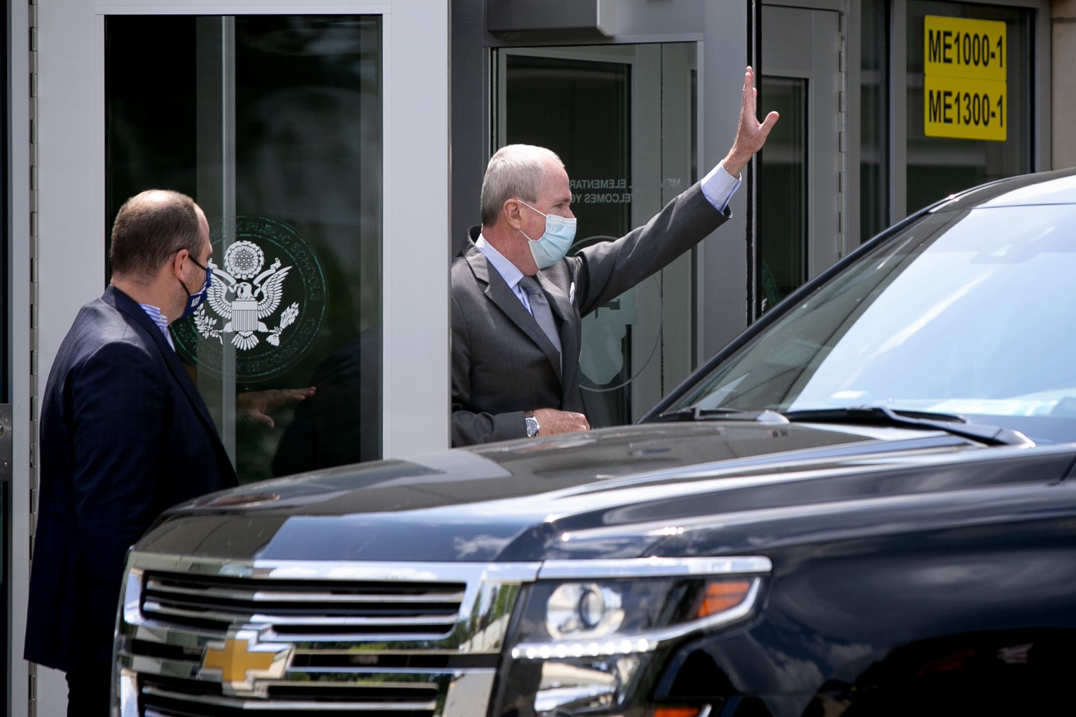 Protesters greet Gov. Murphy as he announces indoor mask mandate for ...