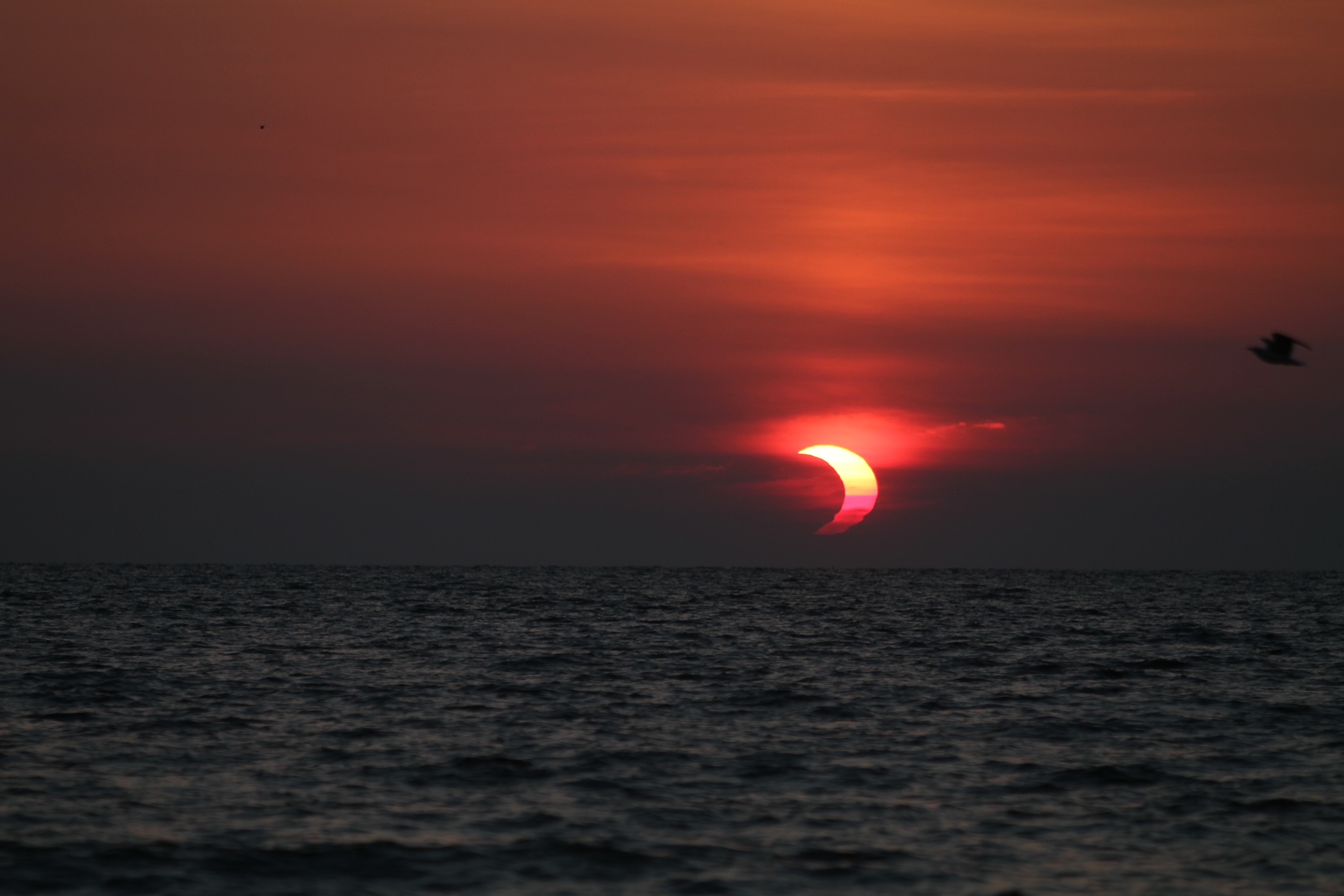 Sunrise solar eclipse over Lake Huron - mlive.com