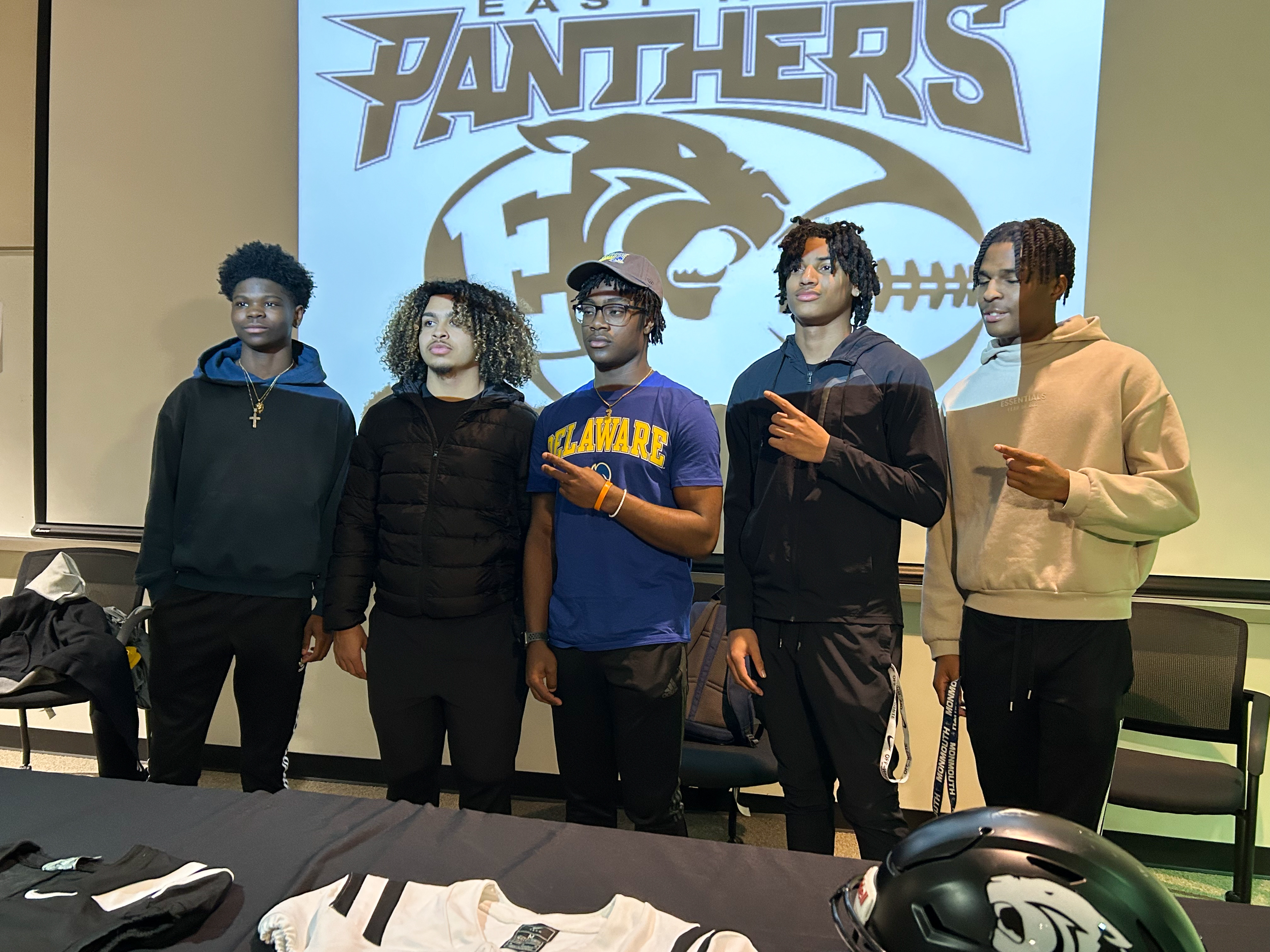Central Dauphin East running back Jared Porter, center, announces his ...