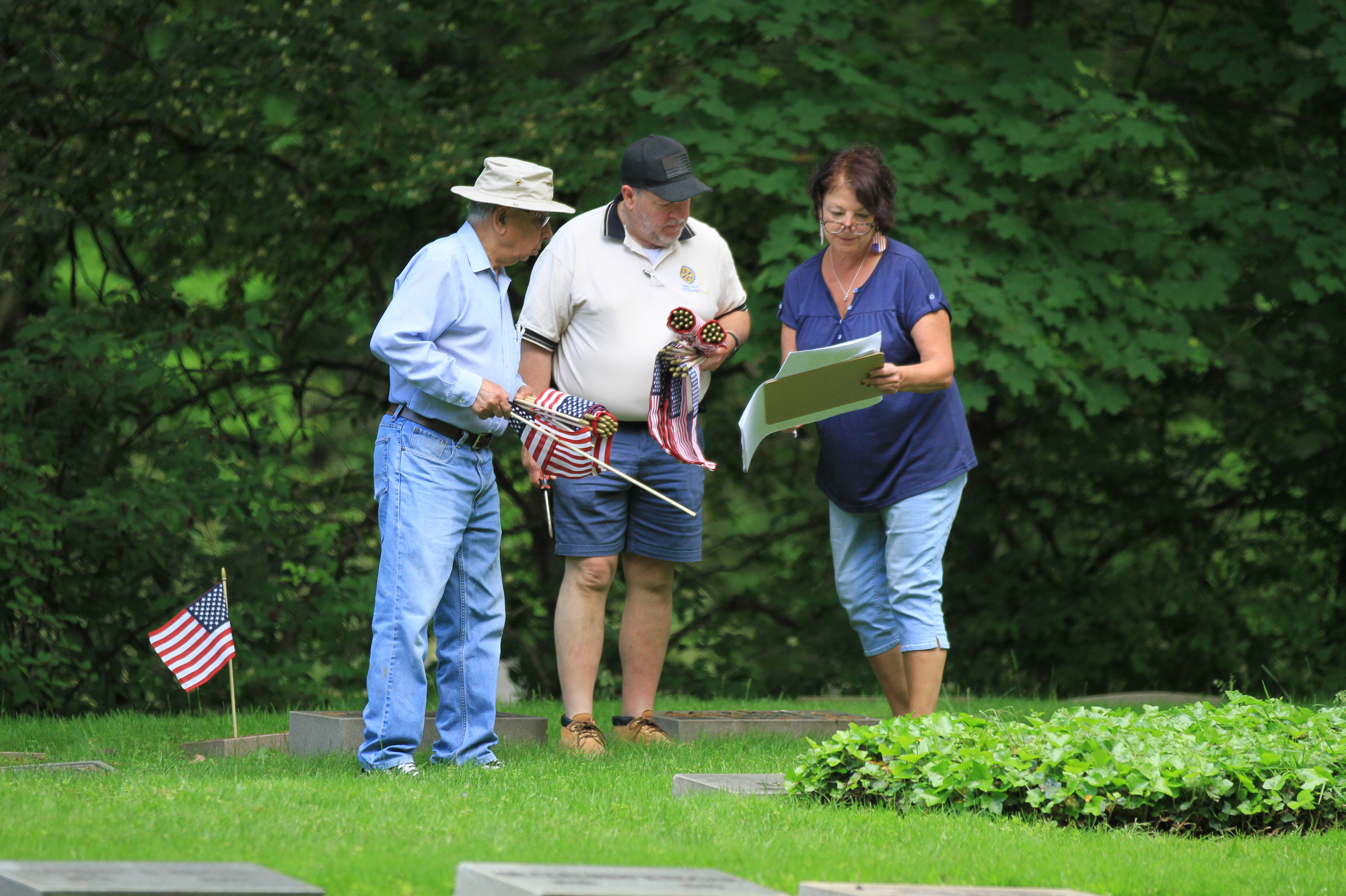Flags placed on gravesites at Lake View Cemetery for Memorial Day ...