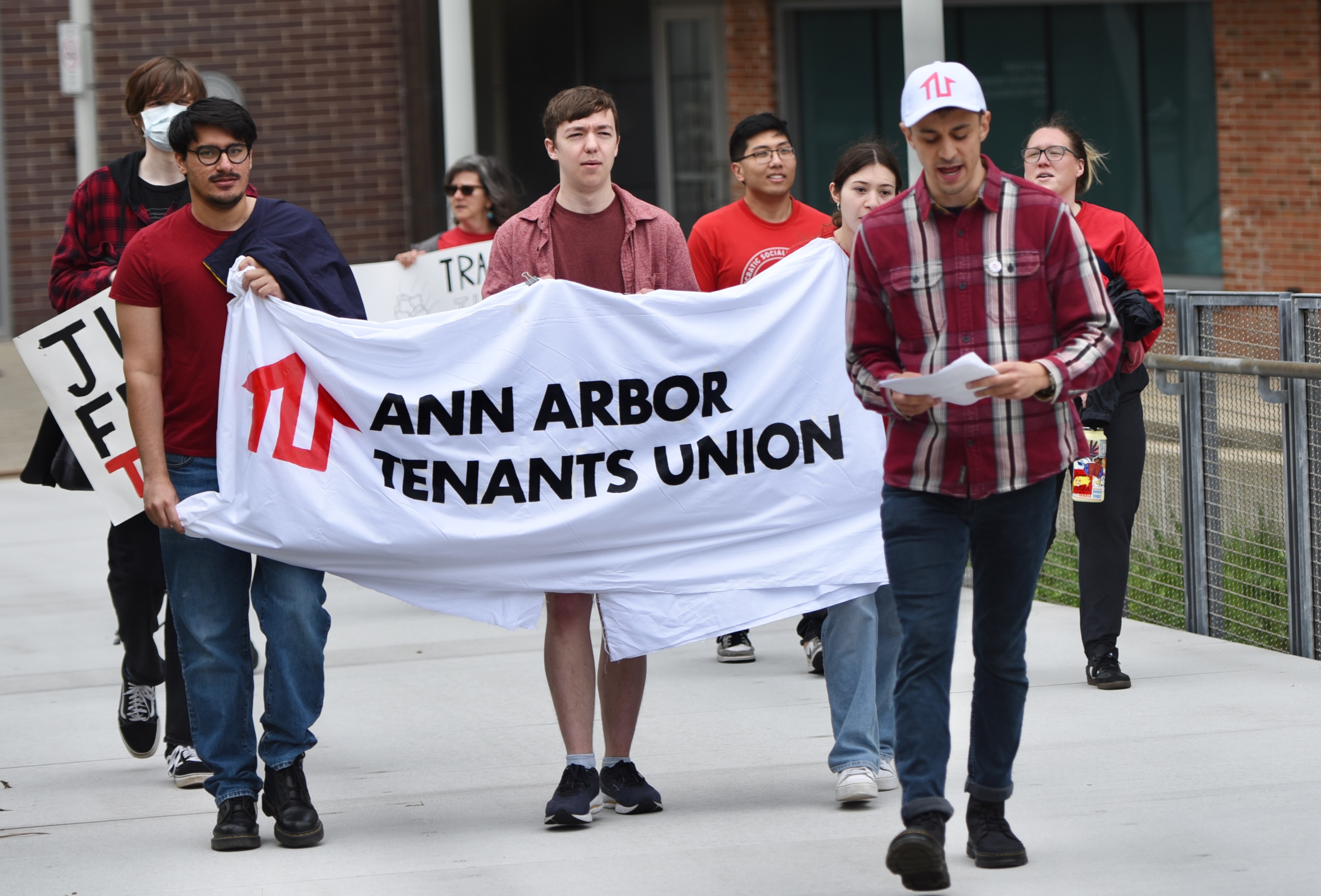 Protest against rental 'junk fees' charged by Ann Arbor landlords ...