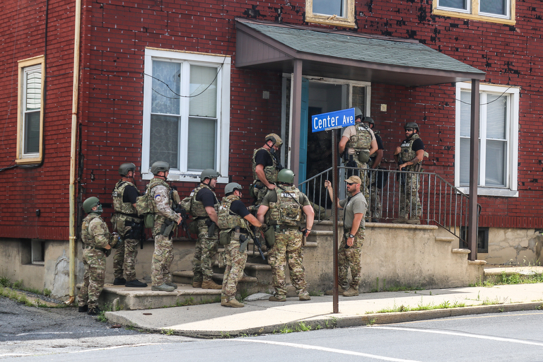 Shooter in mask dispute is wounded in gunfight with cops, police say ...