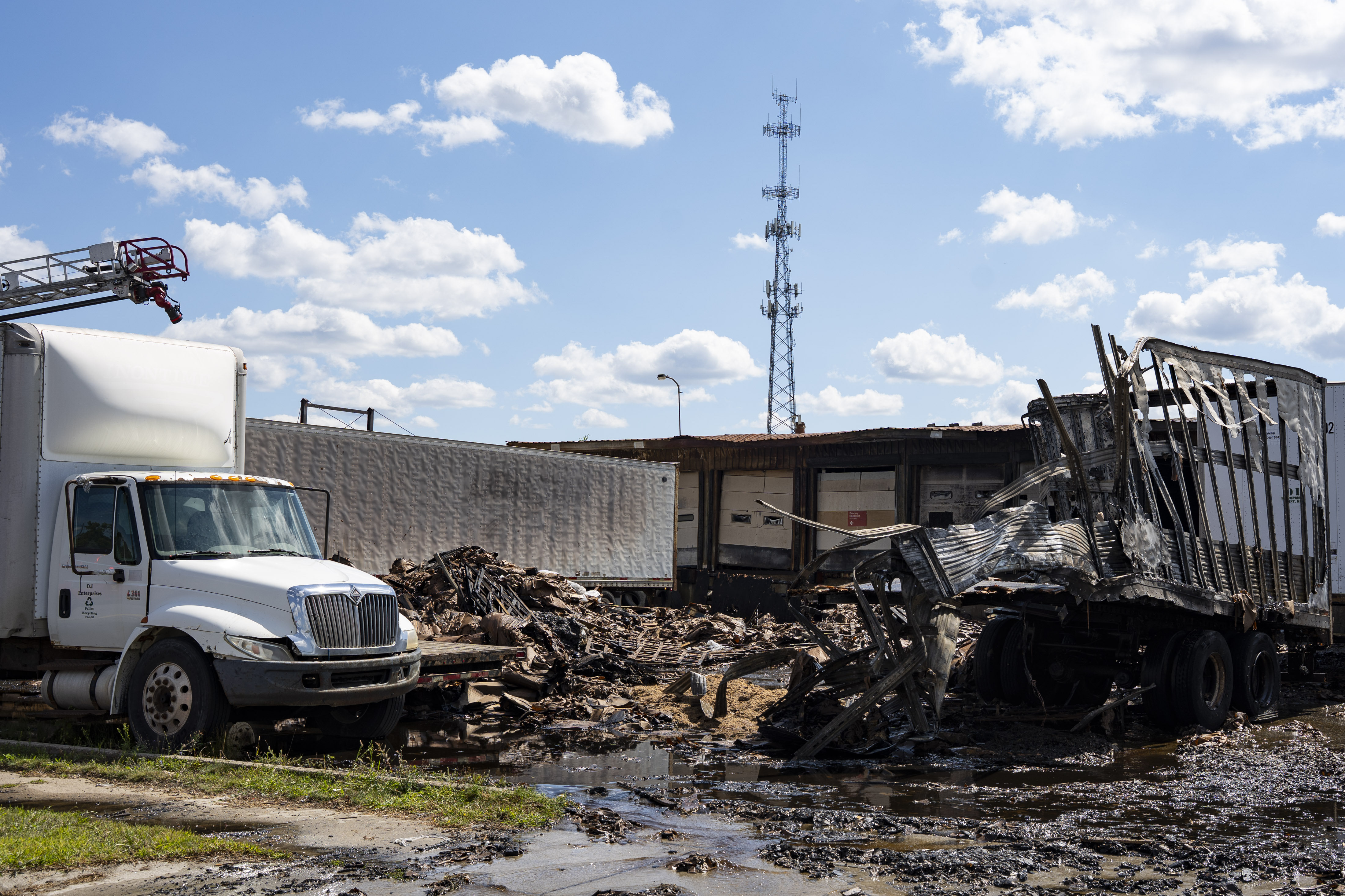 Firefighters work to extinguish a fire at D.I. Enterprises - mlive.com