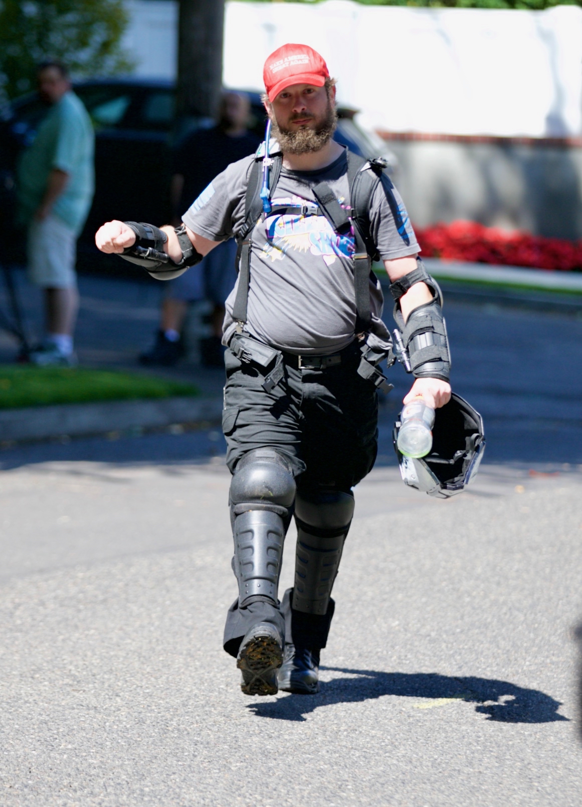 Demonstrators gather outside Portland Mayor Ted Wheeler's house ...