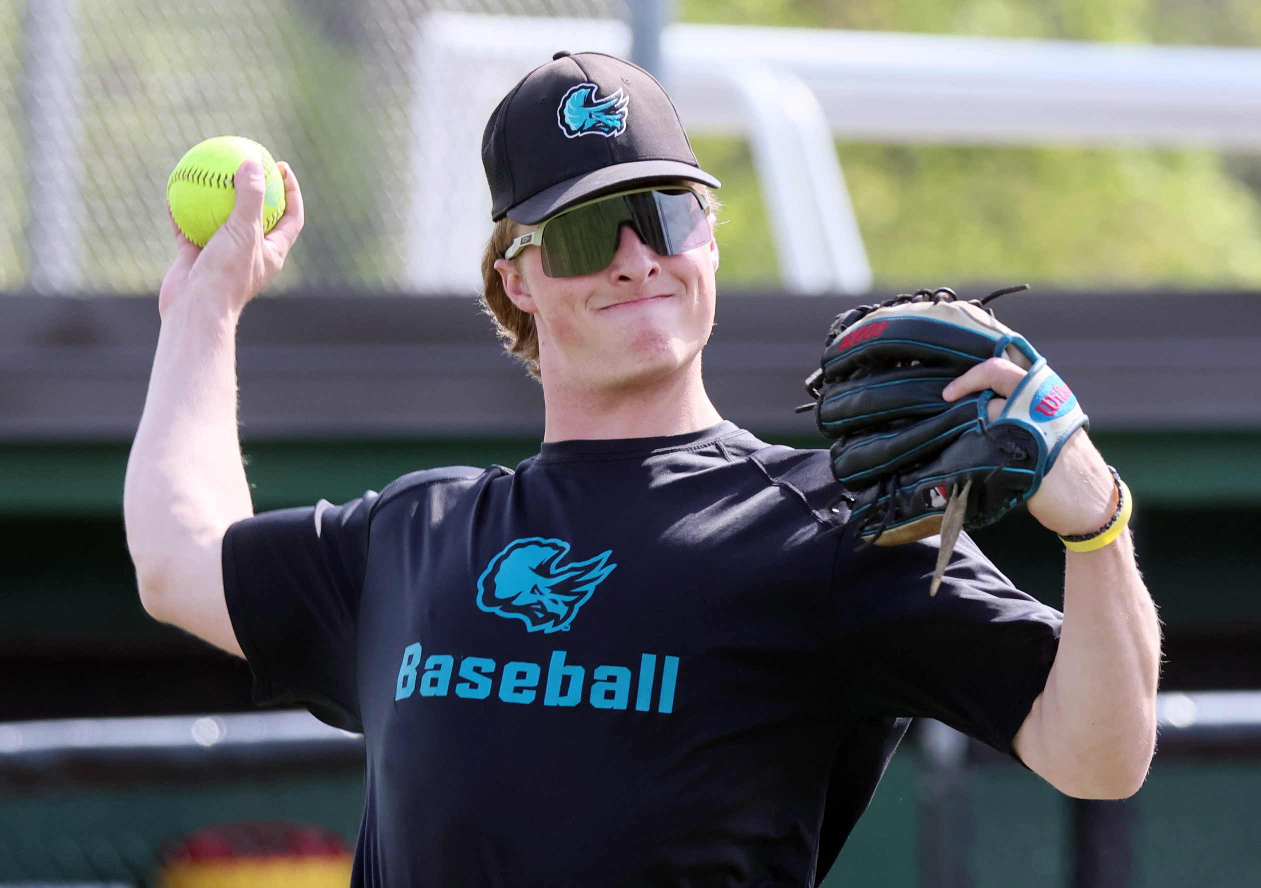 The Tri-C Triceratops baseball team practices before the start of their ...
