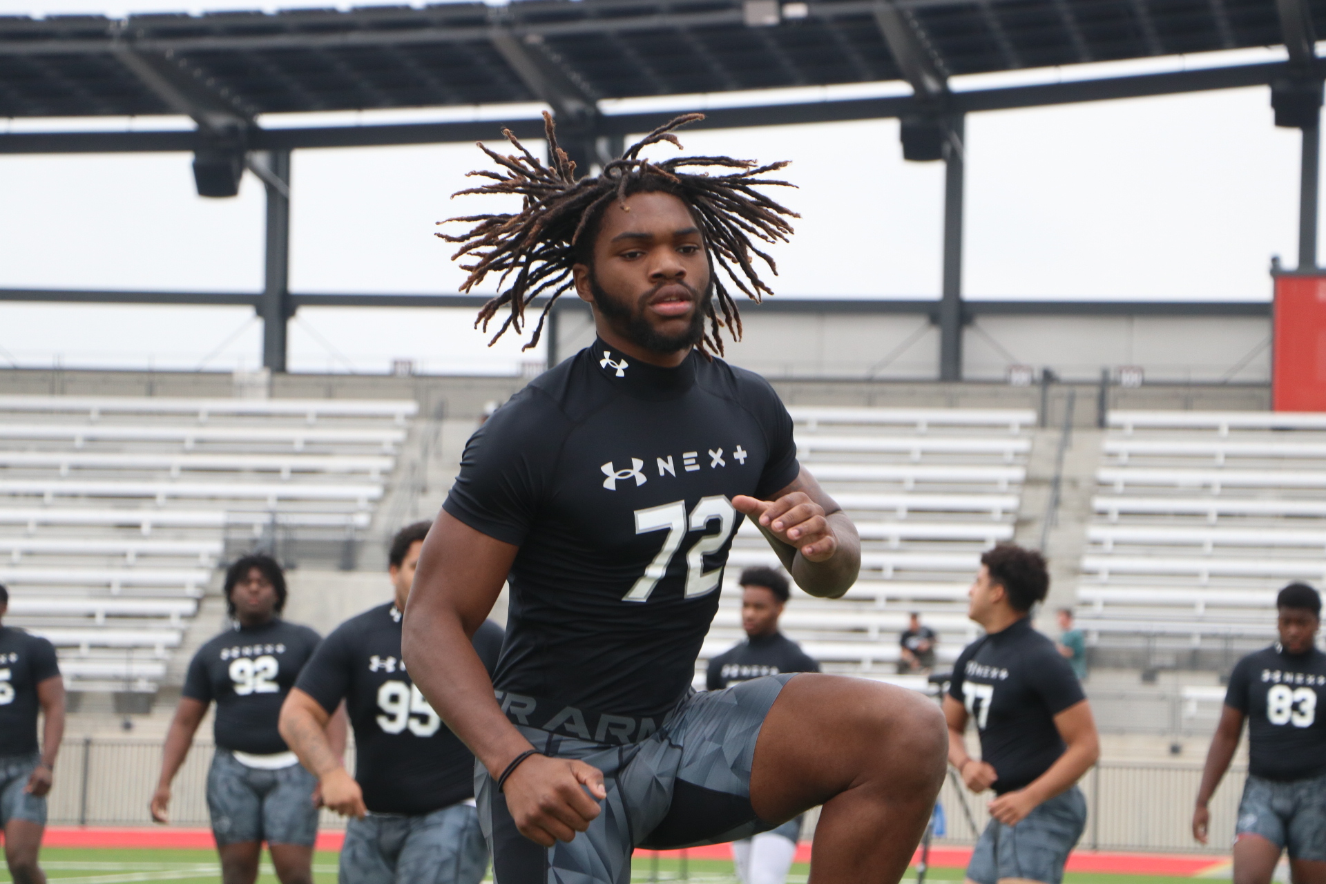 Imhotep Charter defensive end Zahir Mathis runs through drills during ...
