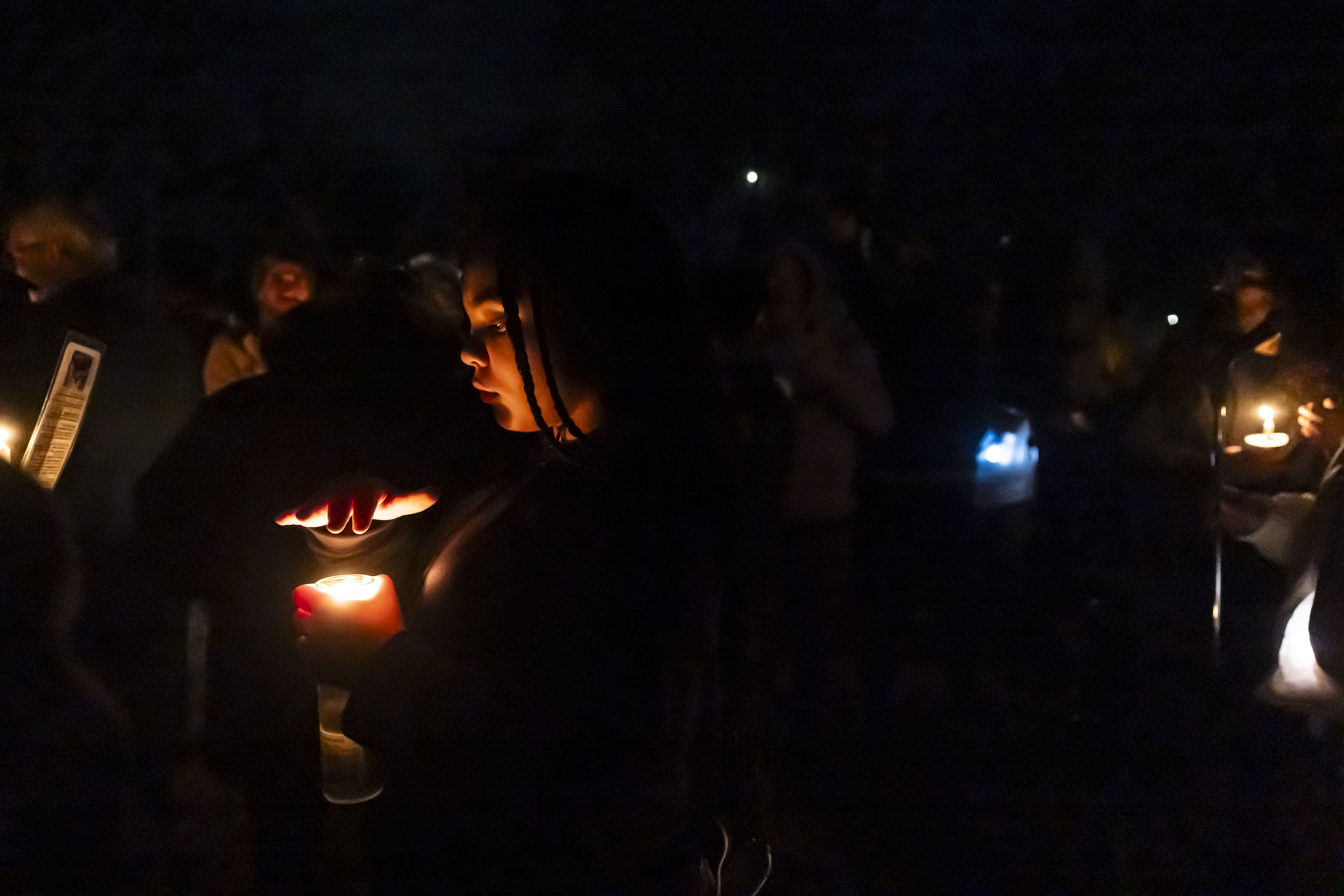 Saginaw community gathers at candlelight vigil in honor of Kevin Rooker ...