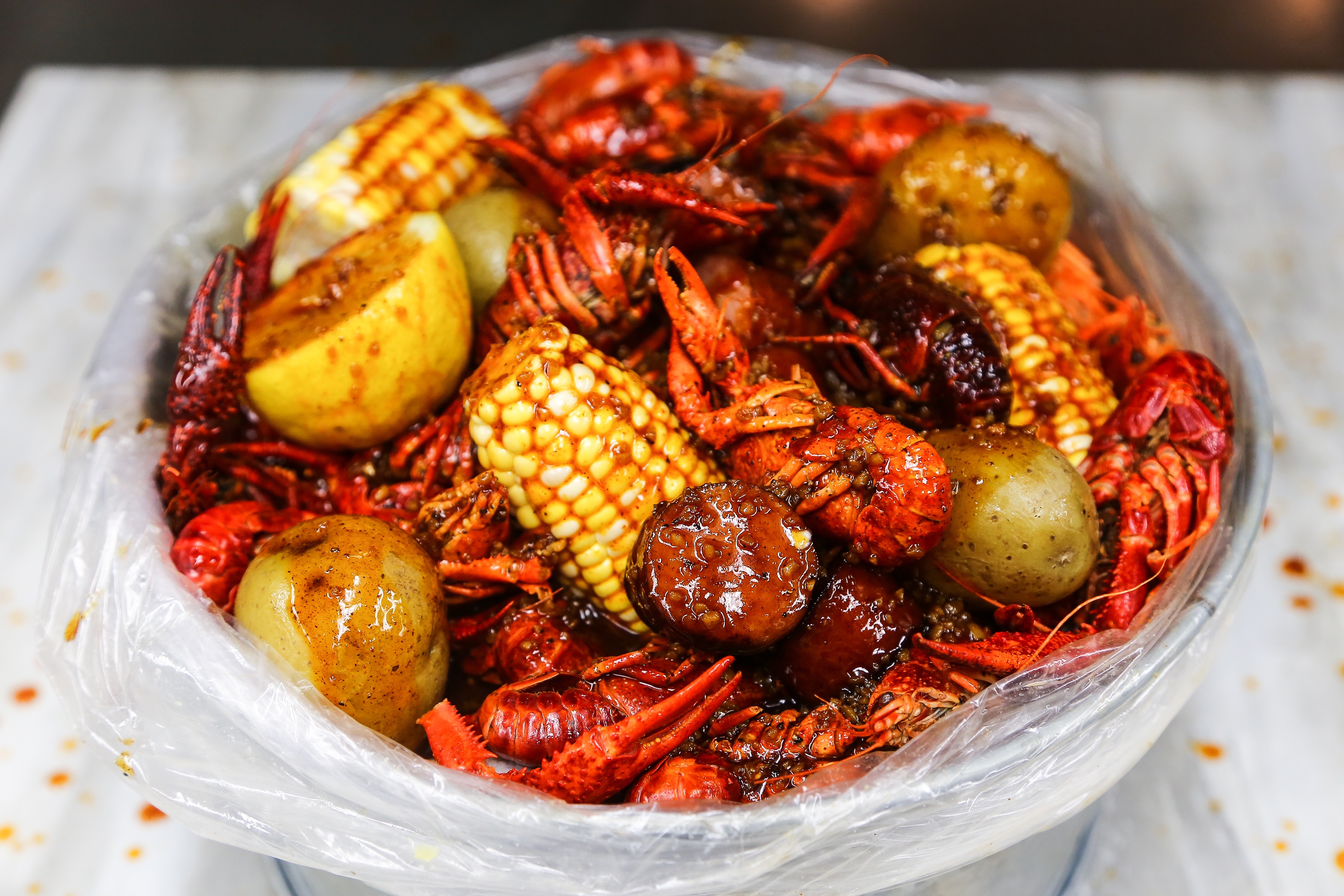 The Sauce Boiling Seafood Express makes quick service bagged seafood meals cleveland
