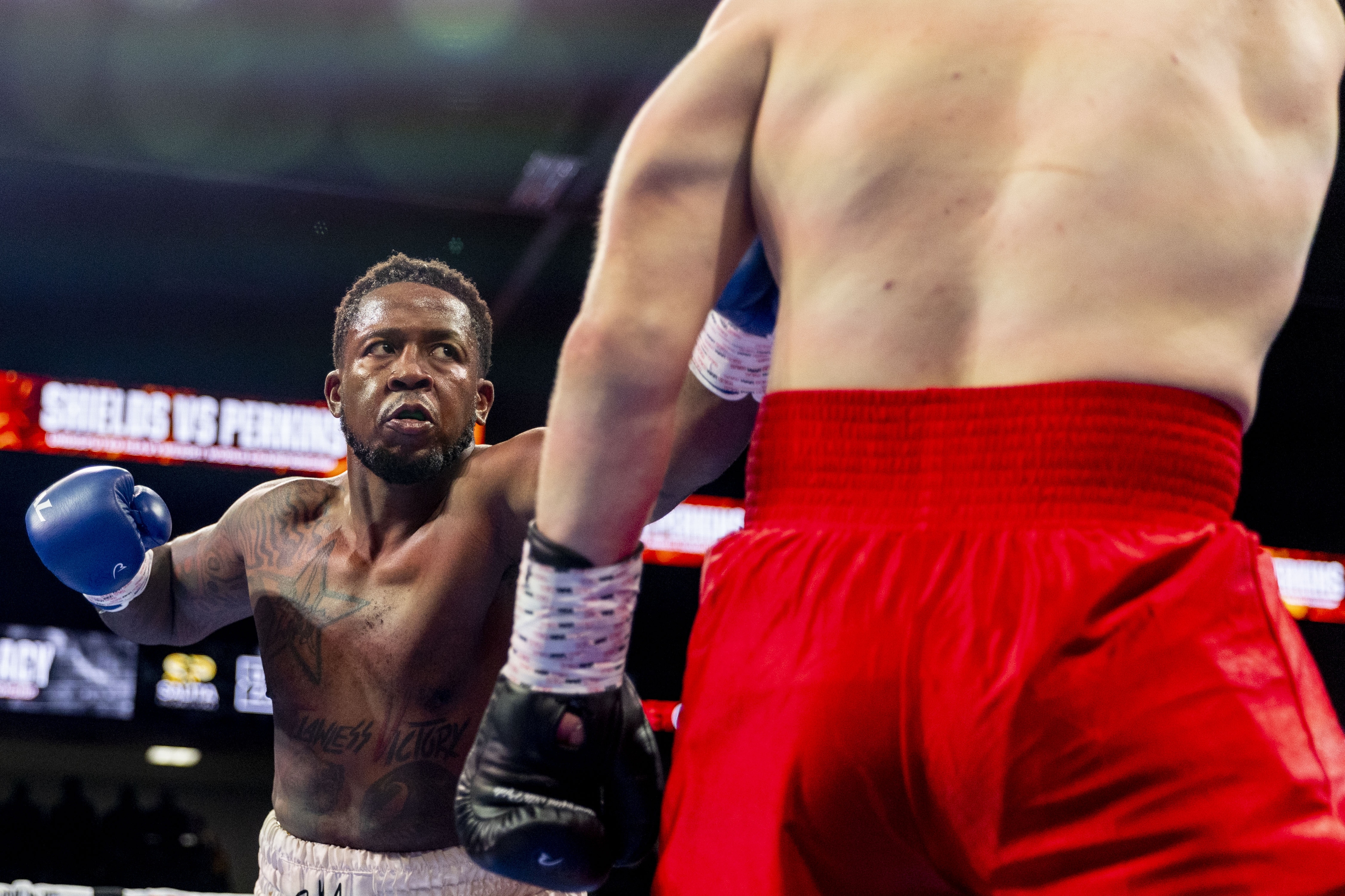 Boxers fly out of the ring and into crowd in WWE style at Michigan bout ...
