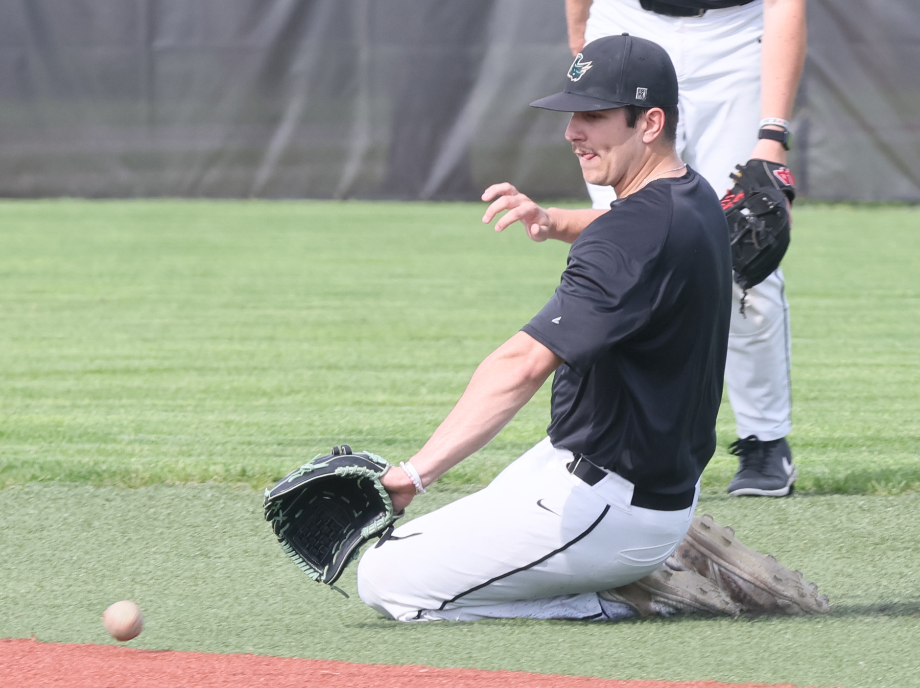 The Tri-C Triceratops baseball team practices before the start of their ...