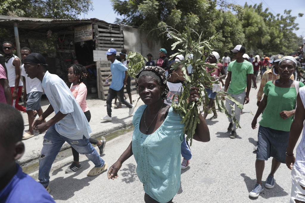 Alix Dorsainvil, a nurse who works for El Roi Haiti, and her daughter ...