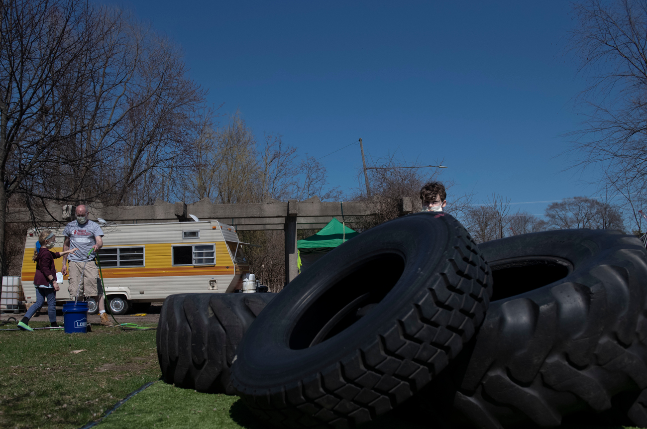 Kevin Leeser and his children prepare shields for healthcare workers ...