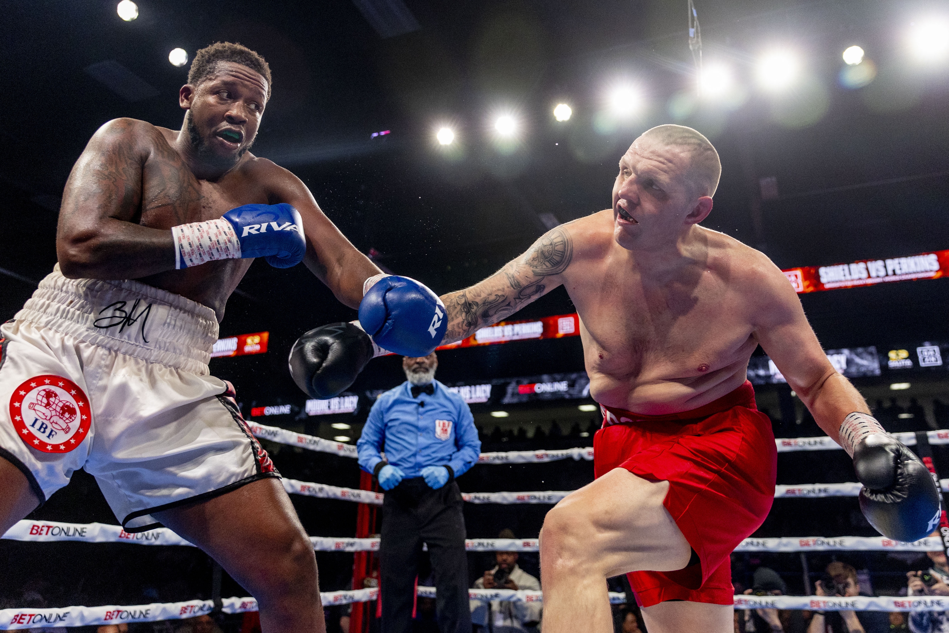 Boxers fly out of the ring and into crowd in WWE style at Michigan bout ...