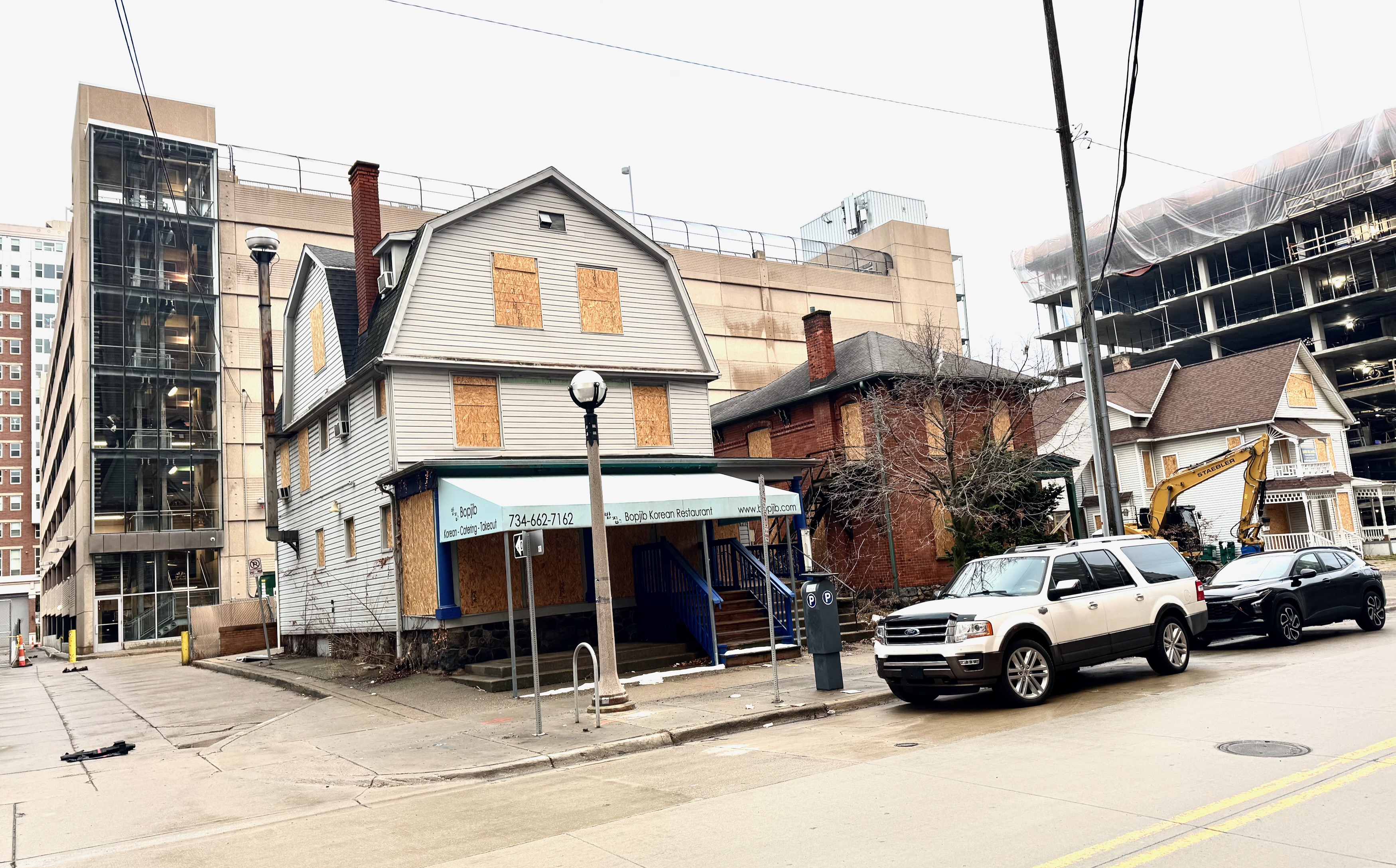 Structures awaiting demolition for 19-story high-rise development in ...