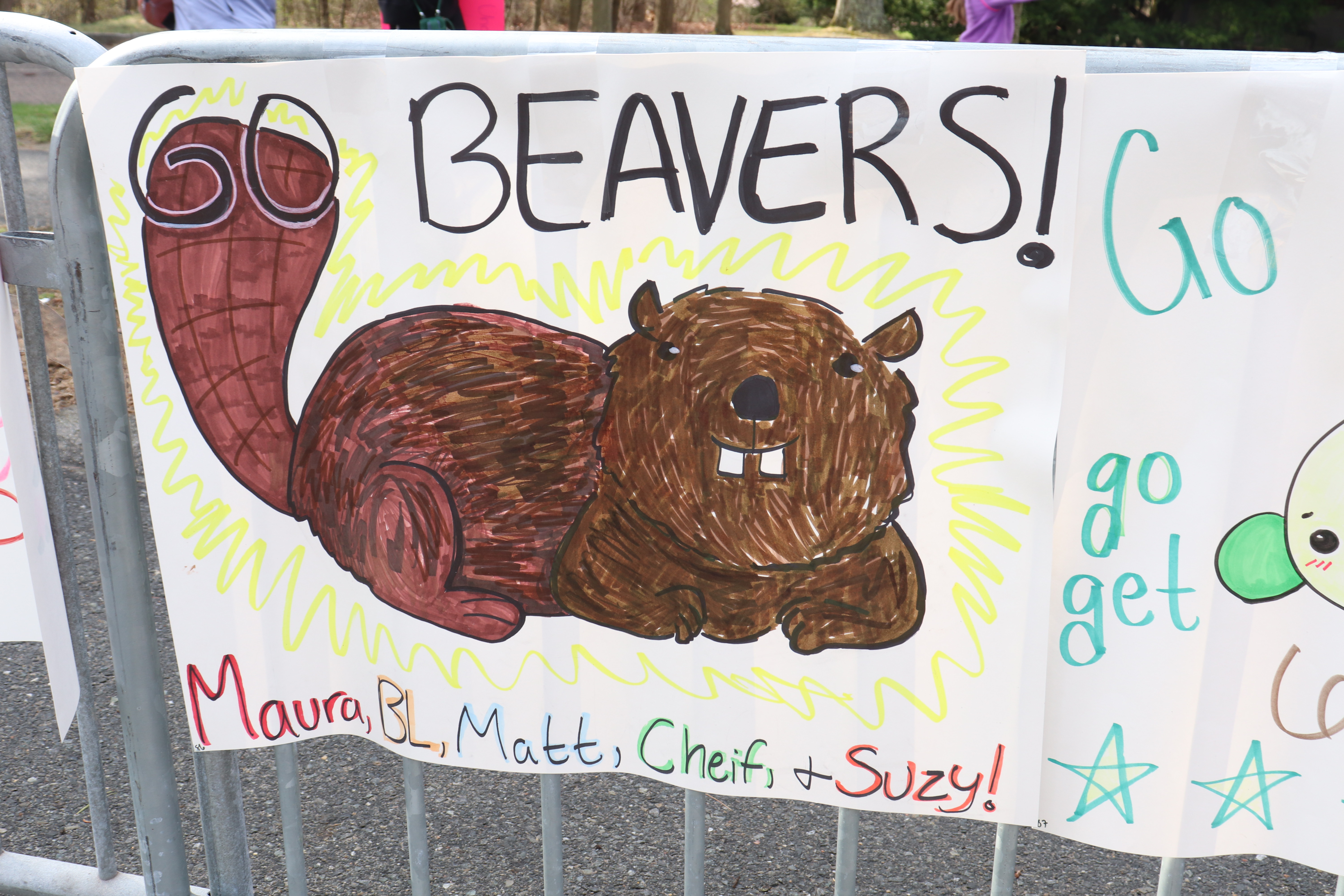 Creative signs along the 2024 Boston Marathon race route at Wellesley ...