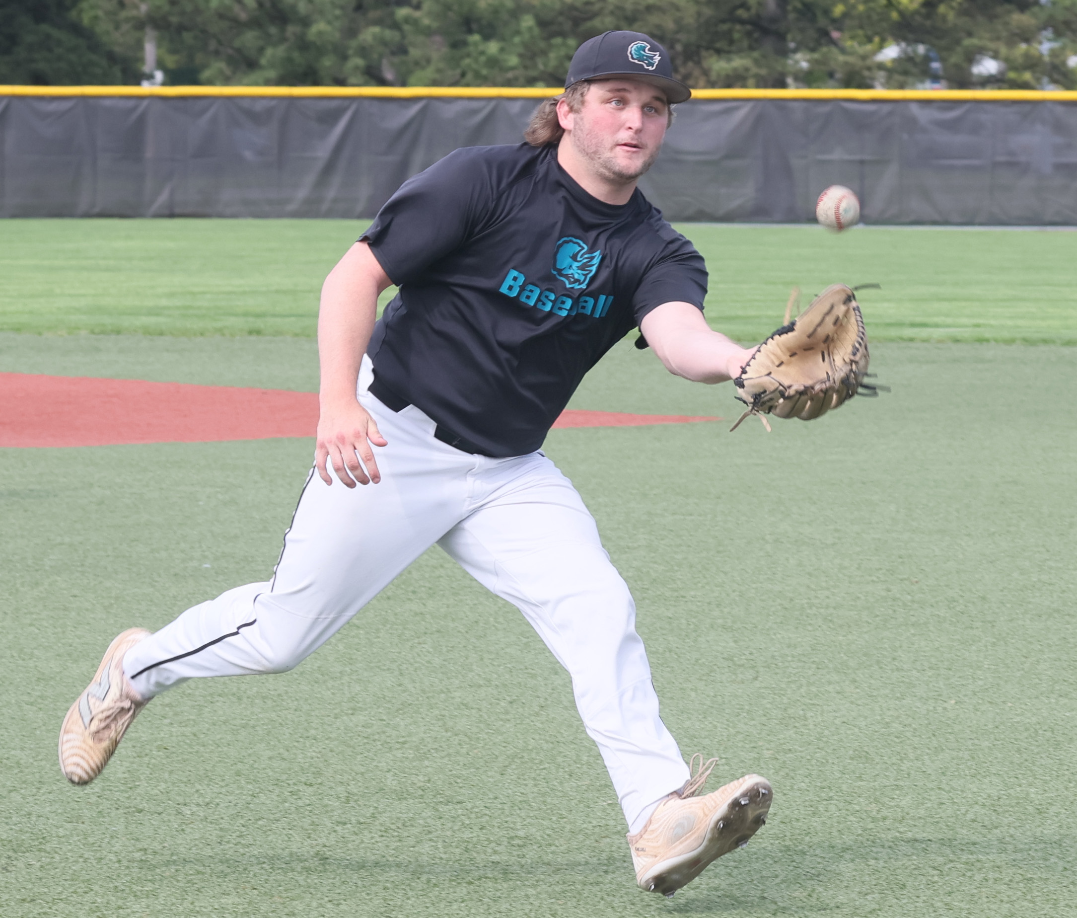 The Tri-C Triceratops baseball team practices before the start of their ...