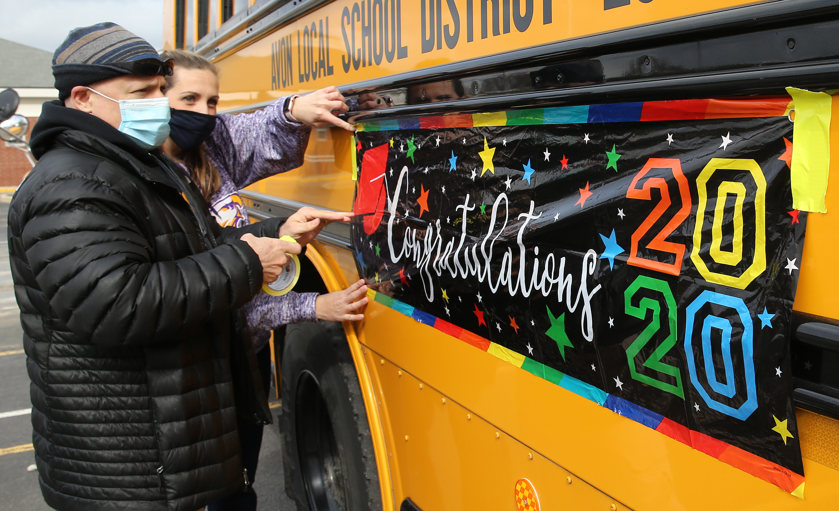 Avon High School uses school buses to deliver senior graduation signs ...