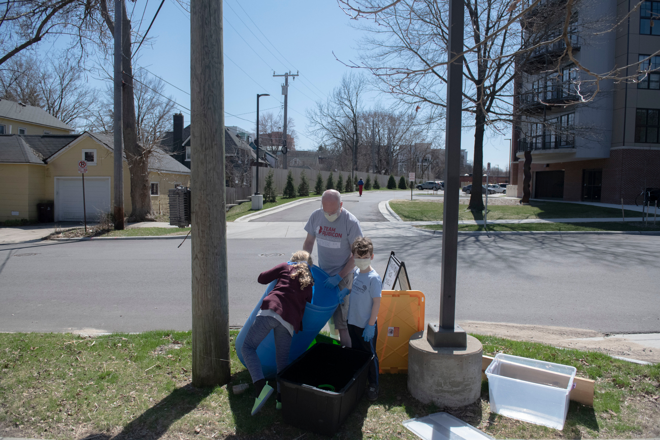 Kevin Leeser and his children prepare shields for healthcare workers ...