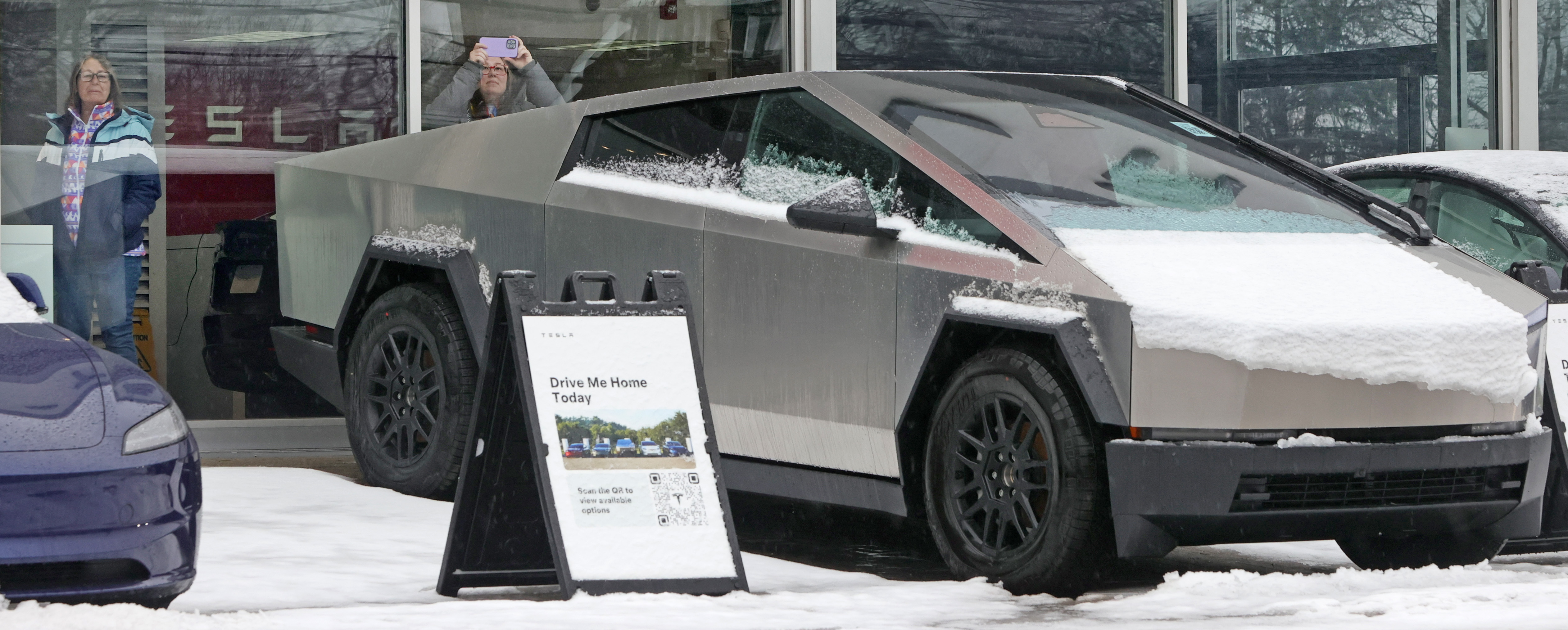 Rally at Tesla Motors Cleveland in Lyndhurst in protest of Elon Musk’s ...