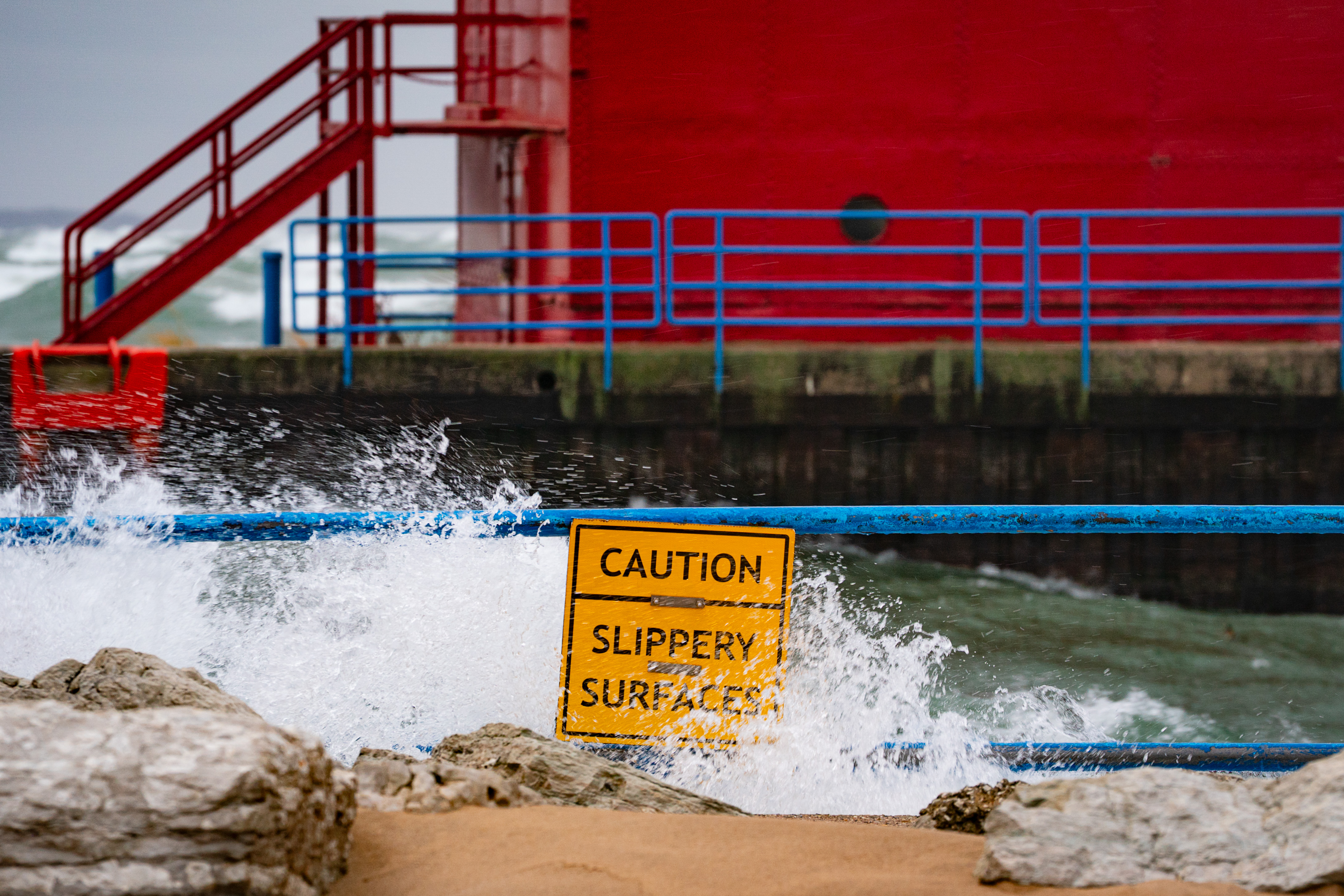 High winds, waves pull people to Holland's lakeshore despite weather ...