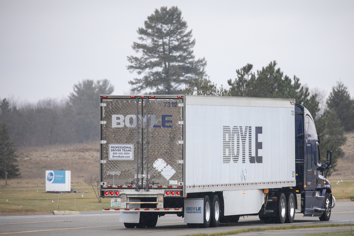 Trucks carrying COVID-19 vaccine depart Pfizer plant in Portage ...