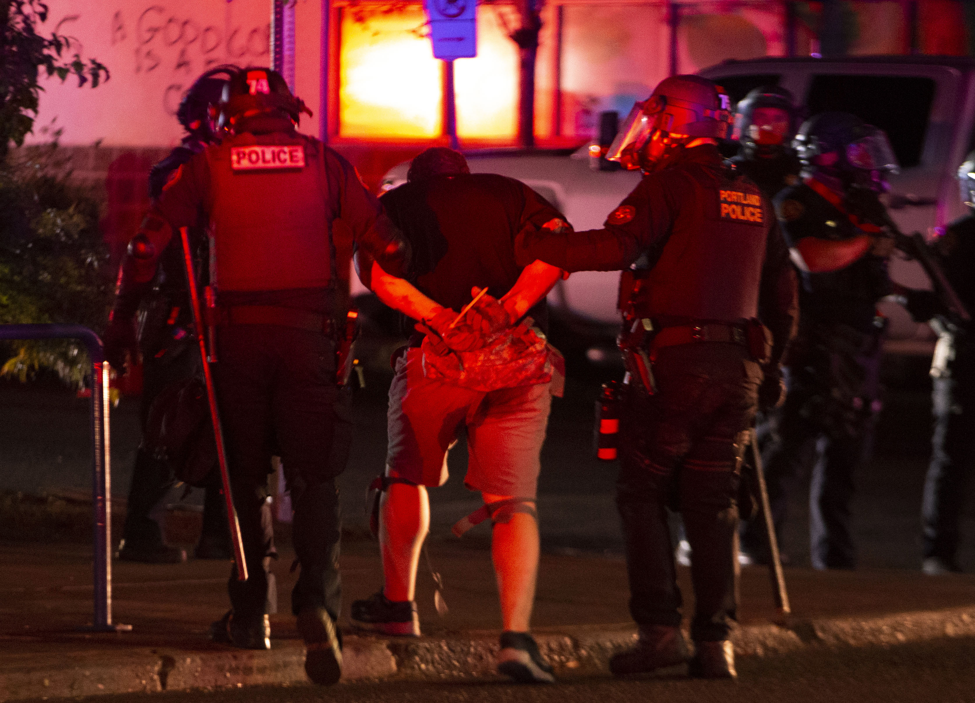 Riot declared as fire set outside Portland police union headquarters ...