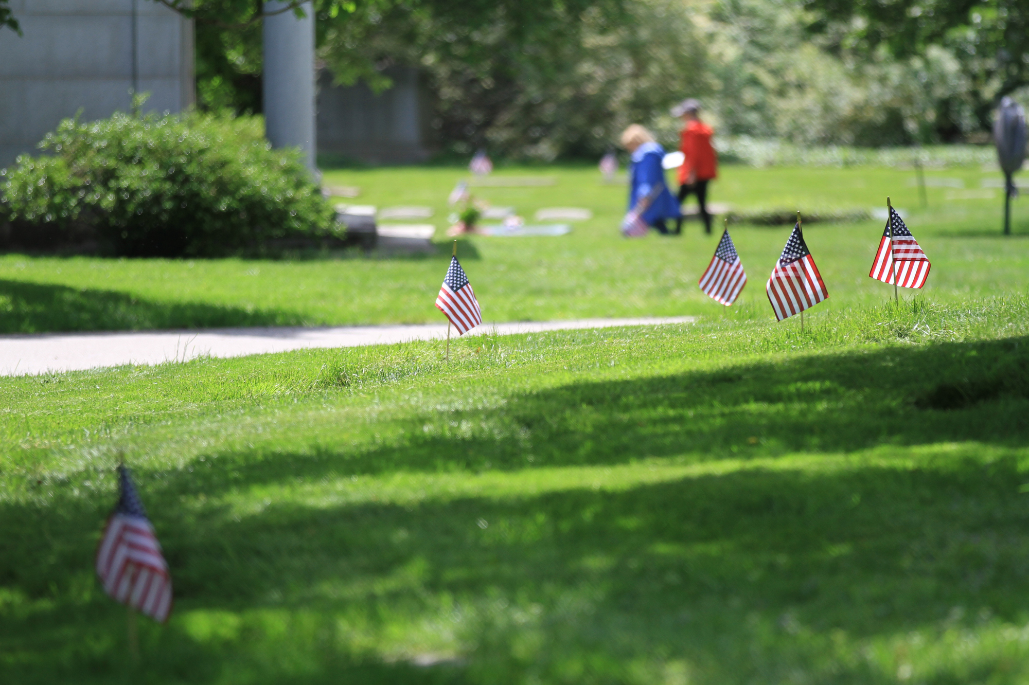 Flags placed on gravesites at Lake View Cemetery for Memorial Day ...