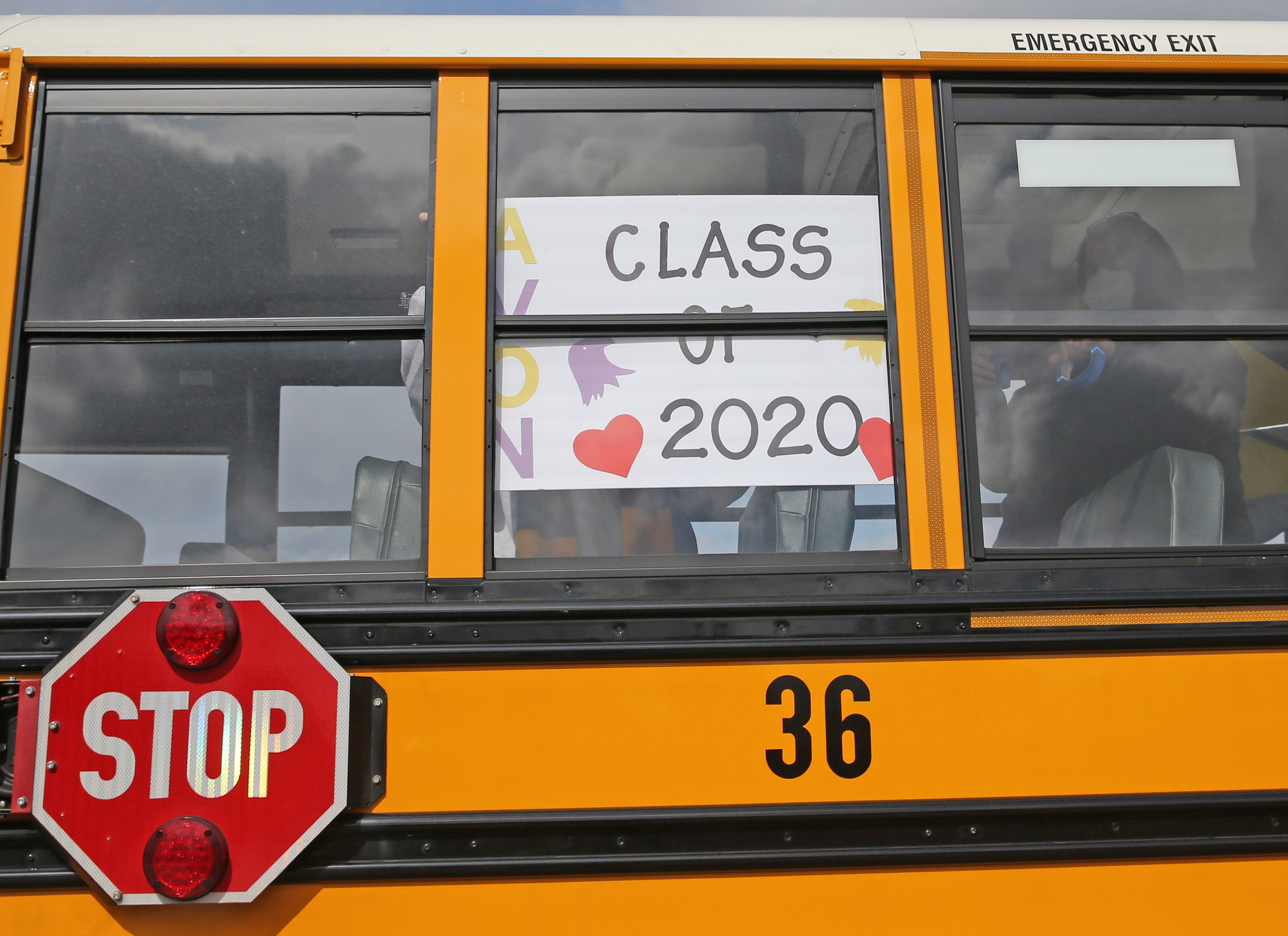 Avon High School uses school buses to deliver senior graduation signs ...