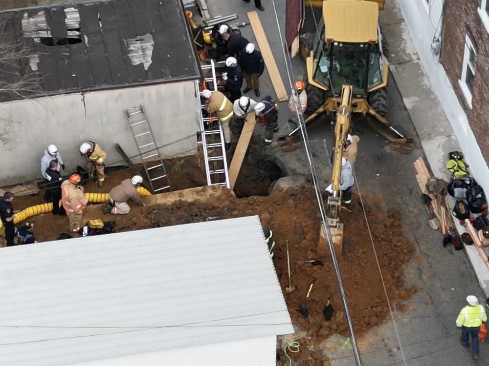 Worker rescued from trench collapse after 8 hours as temperatures ...