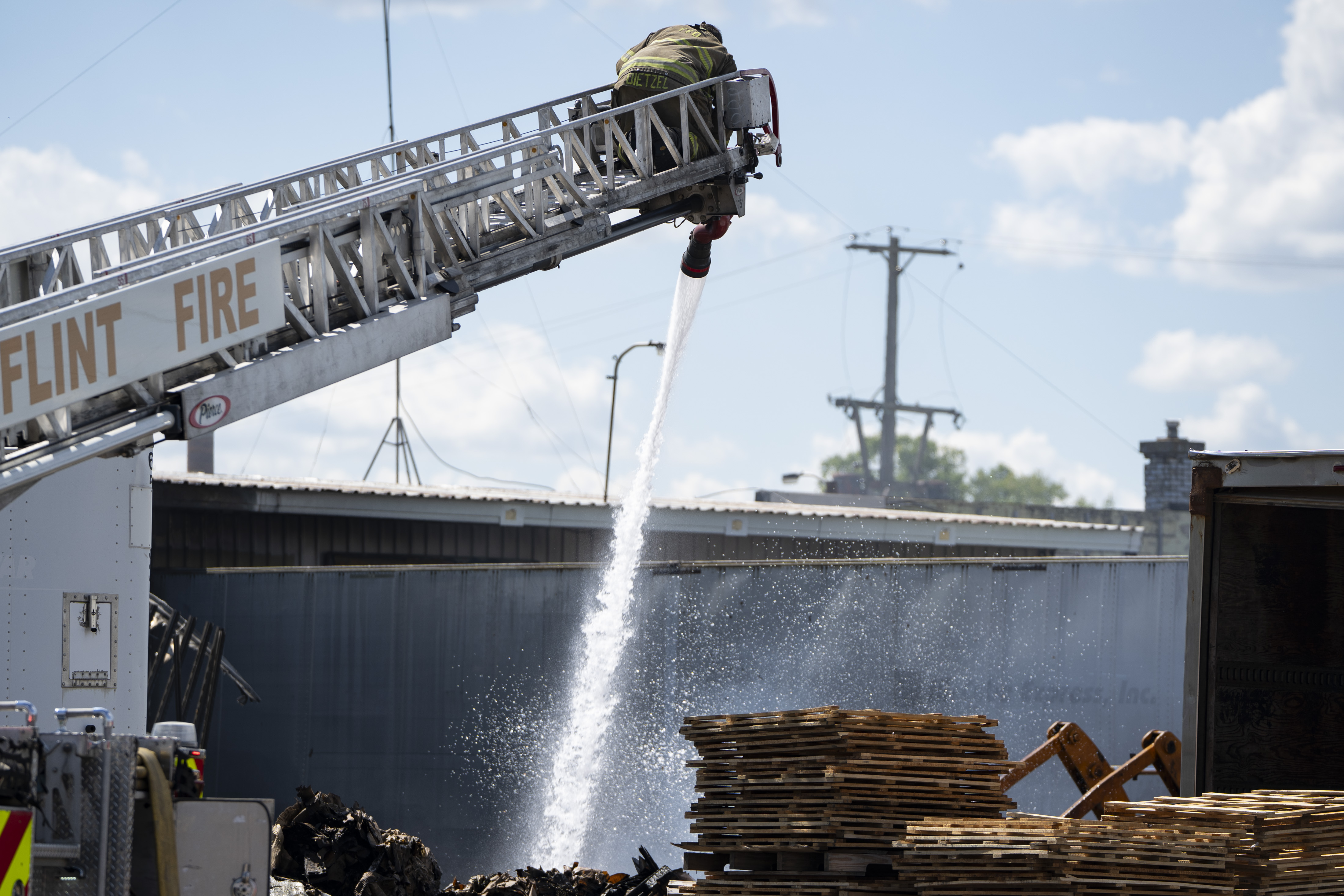 Firefighters work to extinguish a fire at D.I. Enterprises - mlive.com