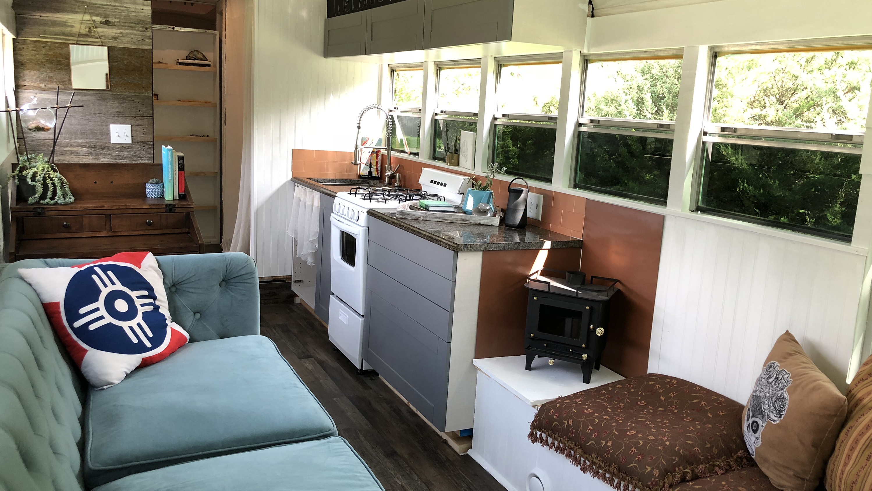 Couple converts school bus into traveling tiny home