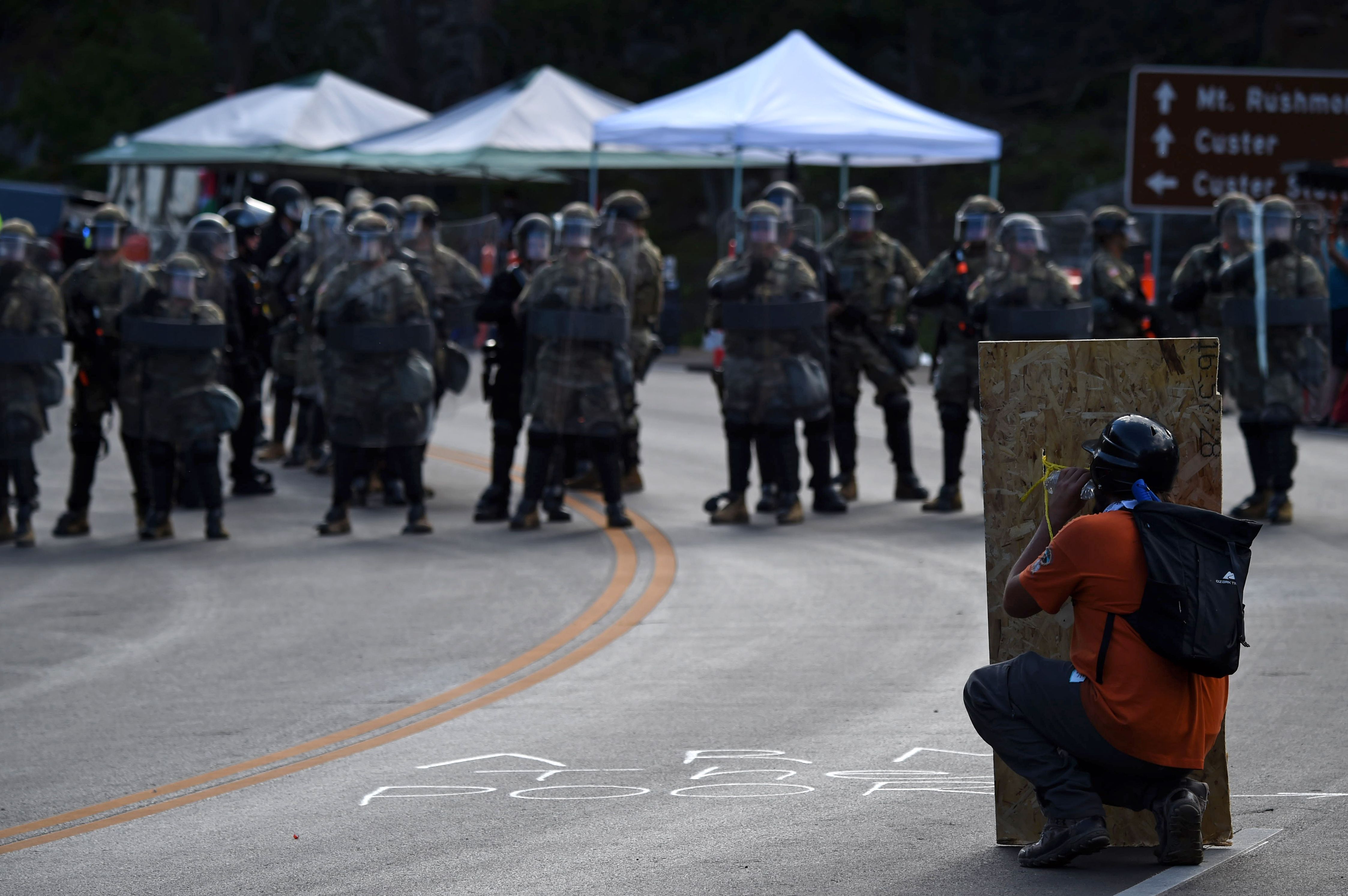 Photos: Protesters block road leading to Mount Rushmore ahead of ...