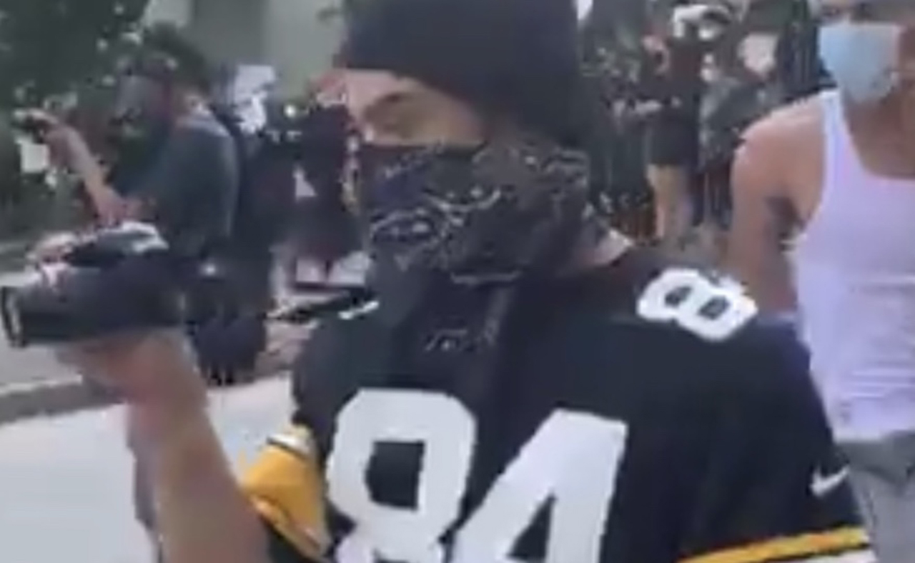 Man arrested on federal charges related to setting police vehicle on ...