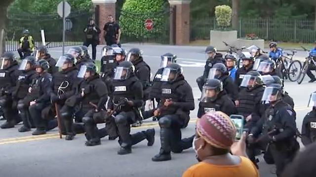 Police officers take knee with protesters in Fayetteville – WSOC TV