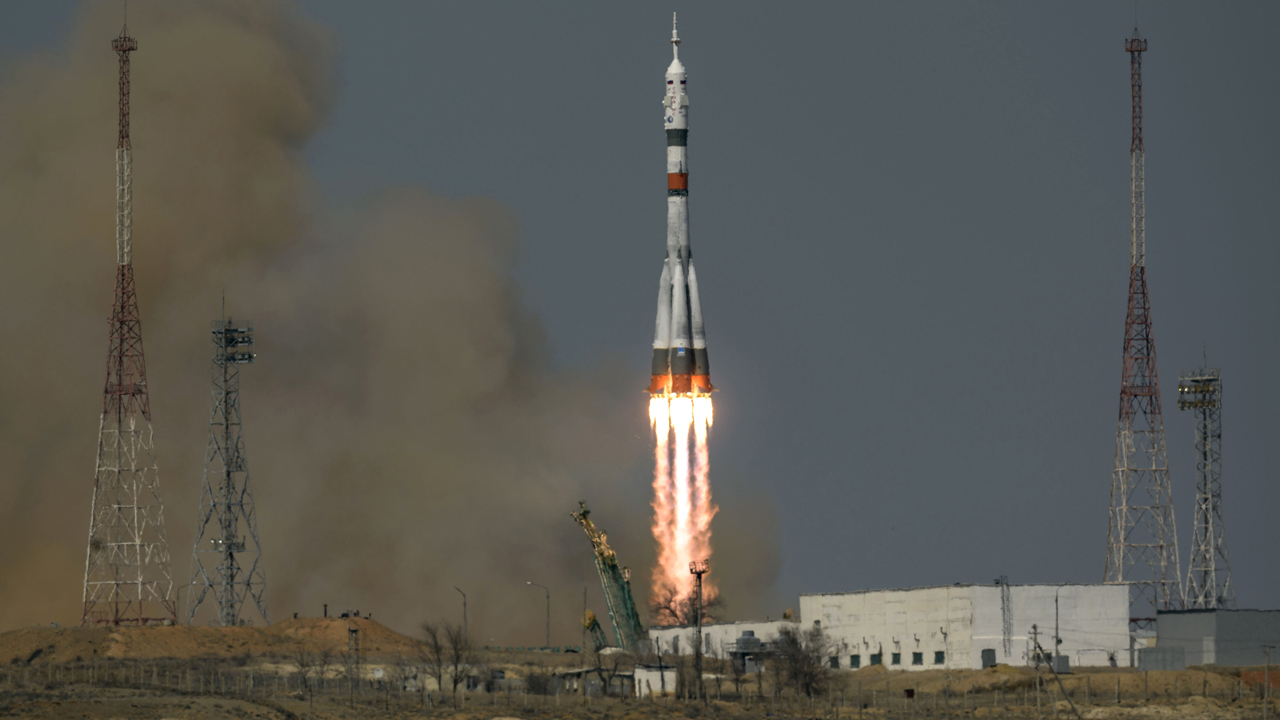 Photos: NASA astronaut, Russian cosmonauts blast off on mission to ...