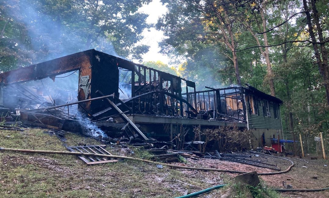 Firefighters rescue elderly woman, teen with special needs from raging ...