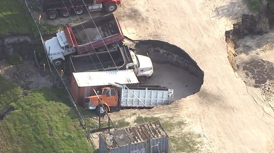 Photos: Holes open in ground, devouring dump trucks. – WDBO
